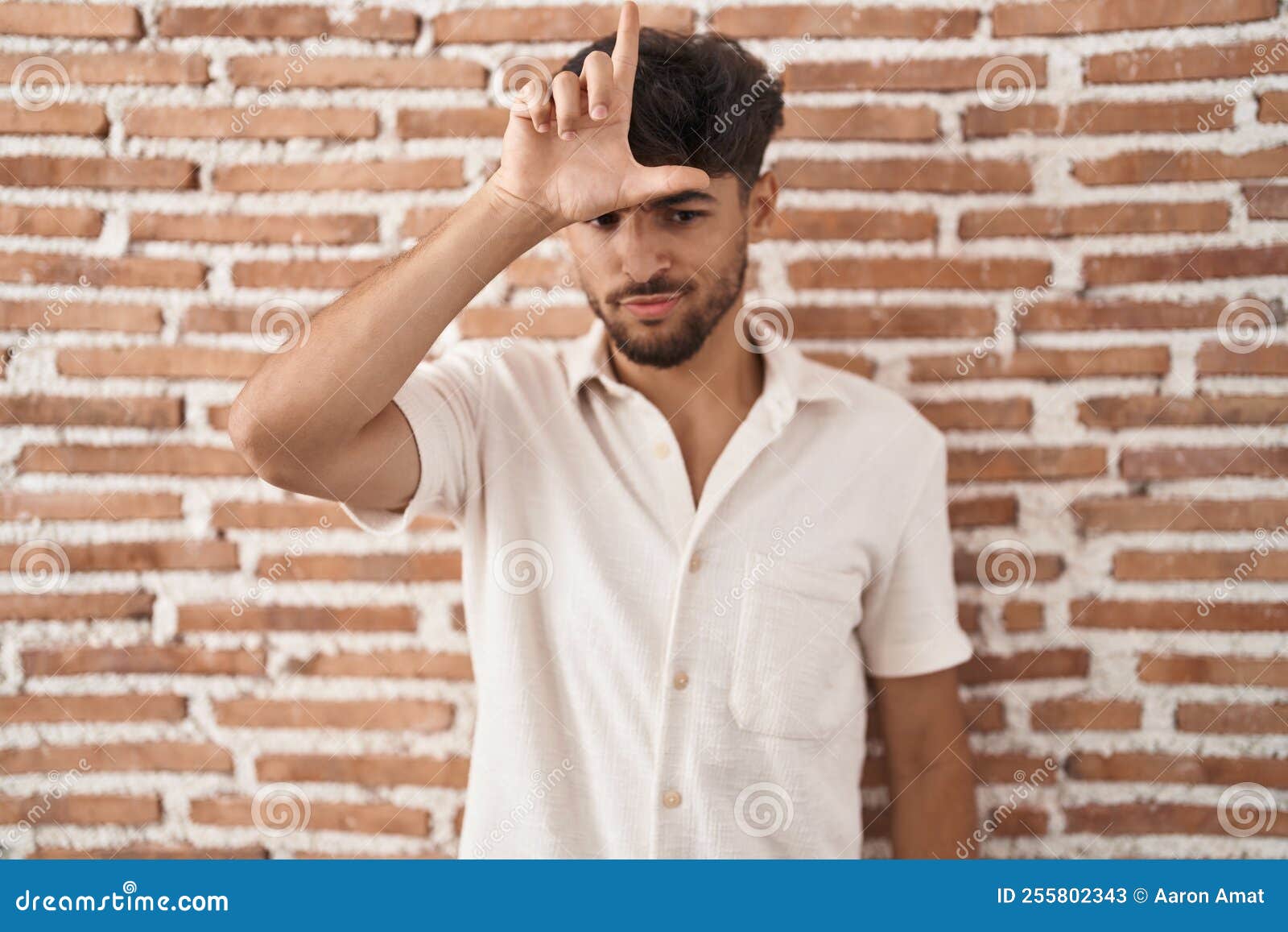 Arab Man with Beard Standing Over Bricks Wall Background Making Fun of ...