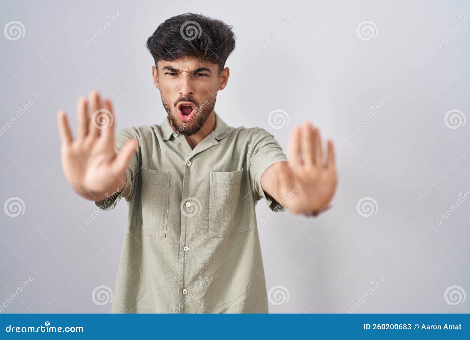 Arab Man with Beard Standing Over White Background Doing Stop Gesture ...