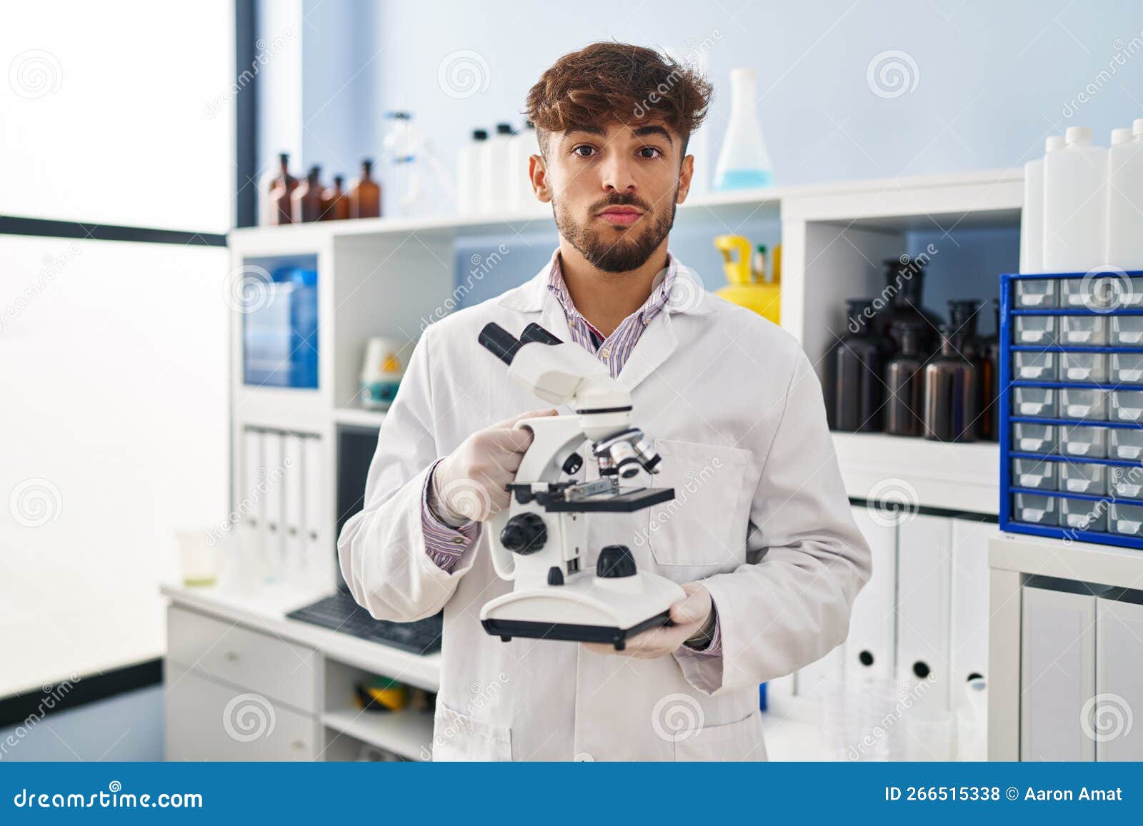 Arab Man with Beard Working at Scientist Laboratory Holding Microscope ...