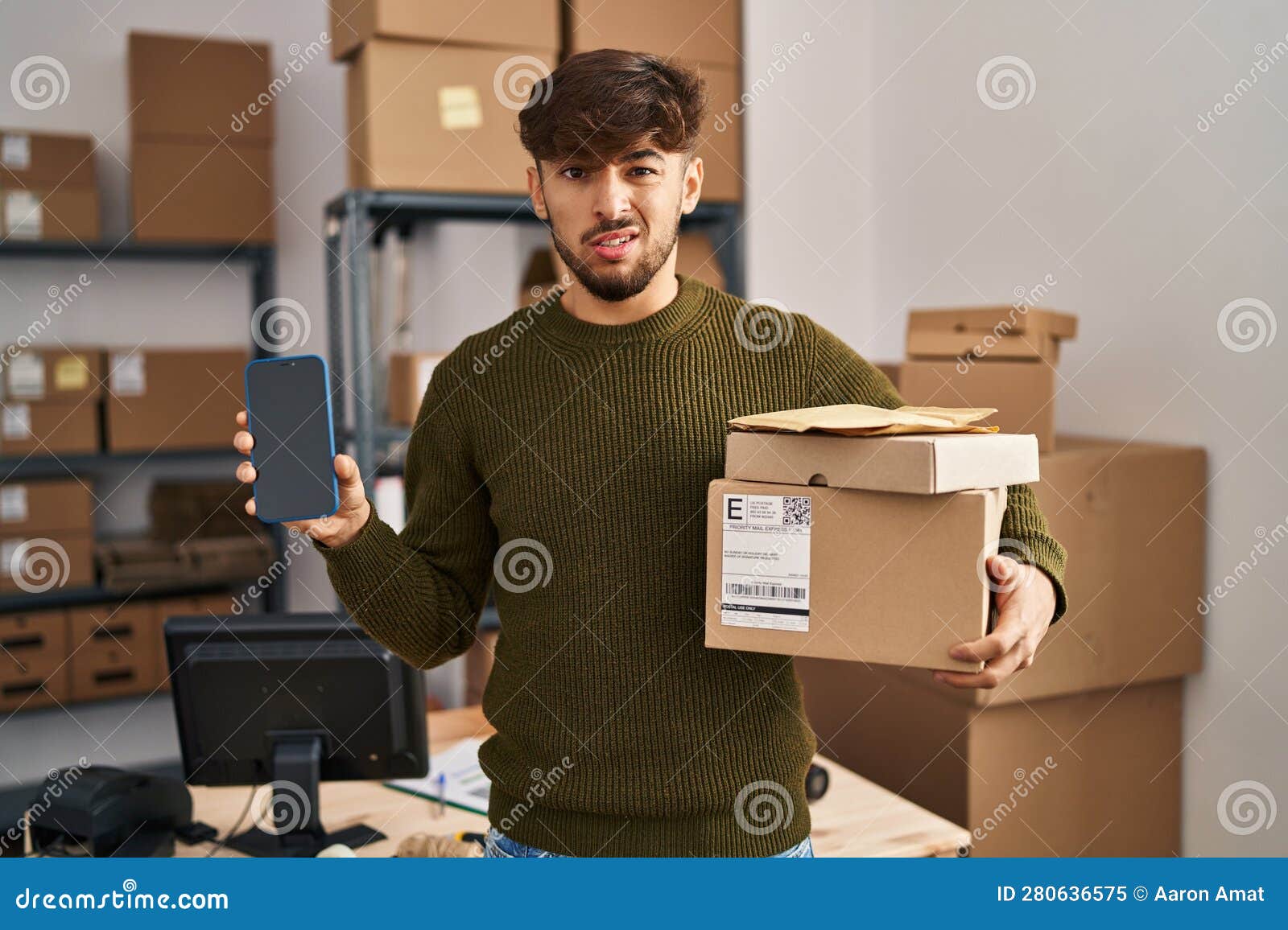 Arab Man with Beard Working at Small Business Ecommerce Holding ...