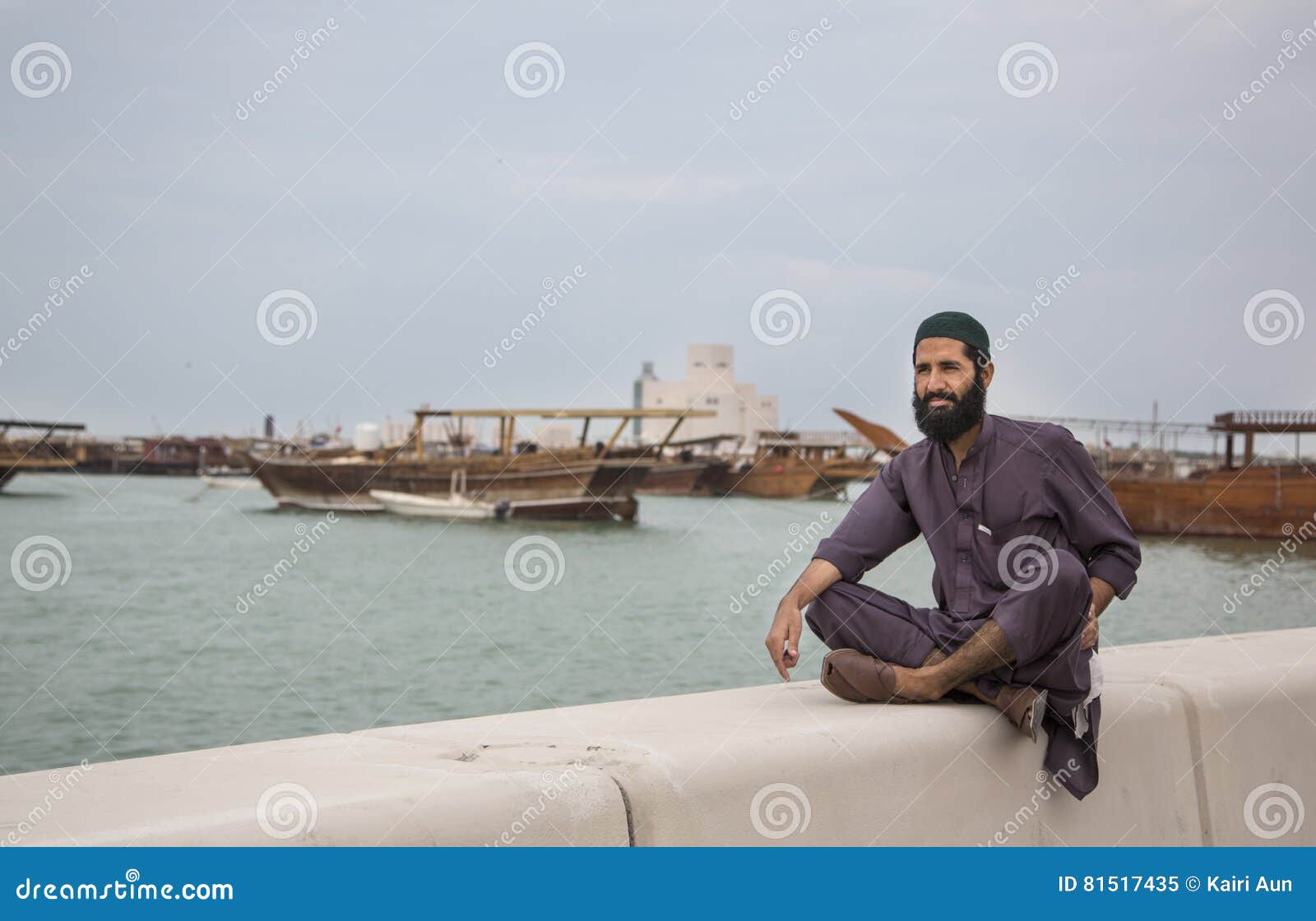 An Arab Man Resting and Looking at Boats Editorial Image - Image of ...