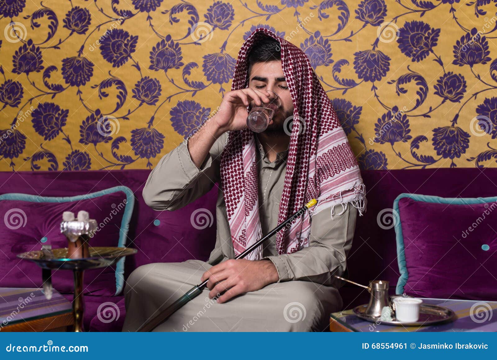 Arab Man Smoking Shisha And Drinking Coffee Stock Image Image 68554961