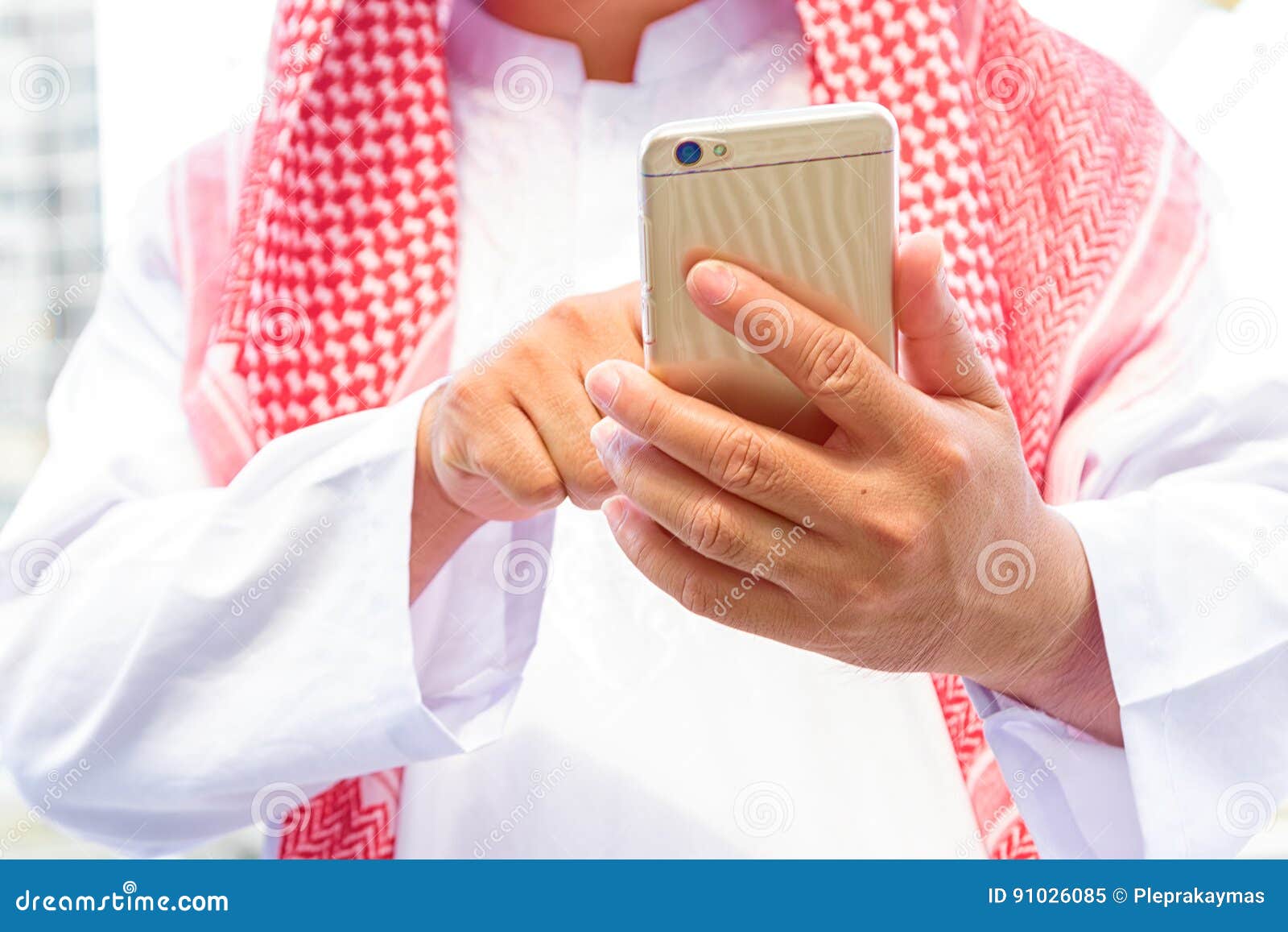 Arab Saudi Emirates Man Hand Texting in a Smart Phone Stock Image ...