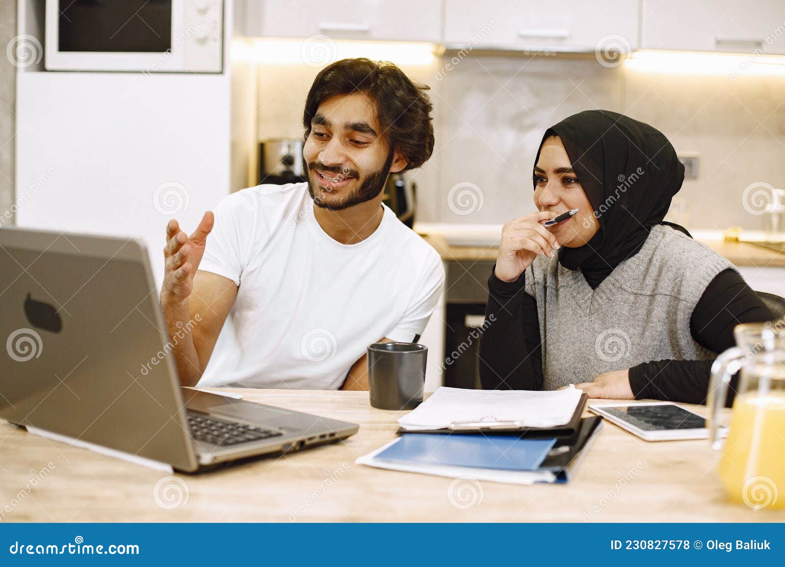Arab Students Studying and Learning at Home with a Laptop and Notes ...