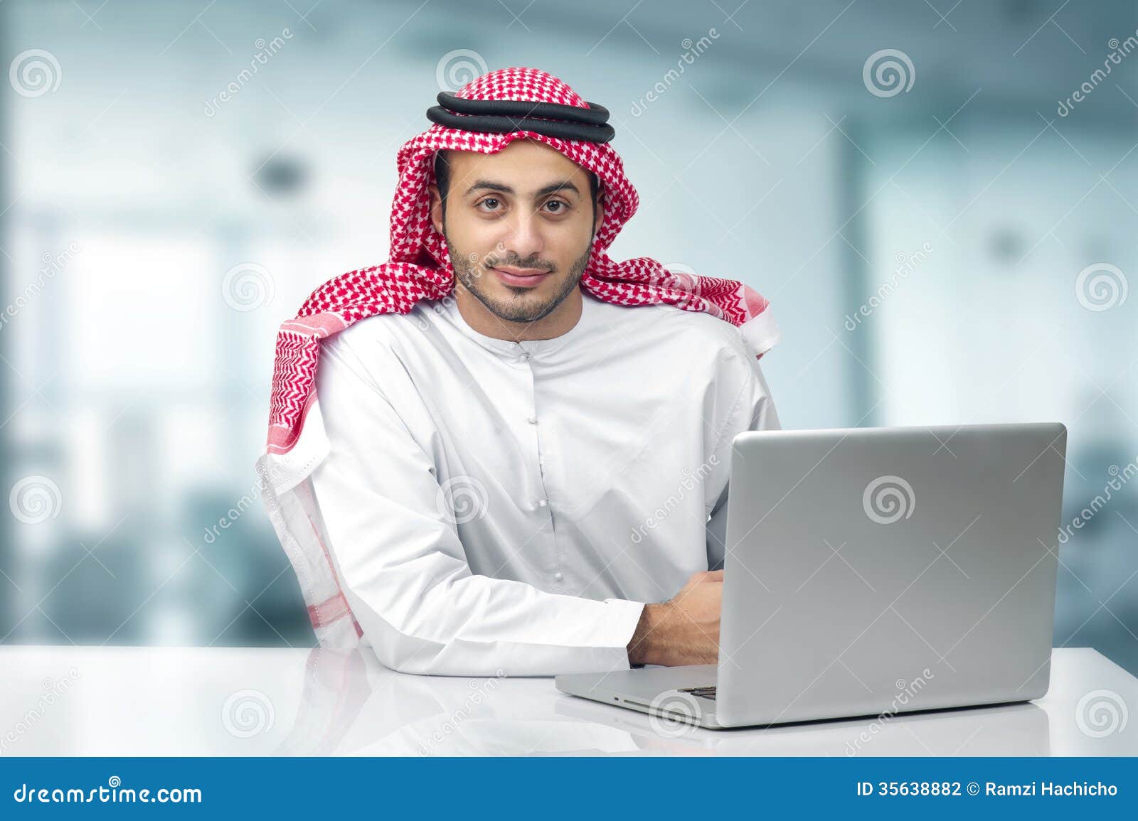 Arabian Business Man Using Notebook in the Office Stock Photo - Image ...