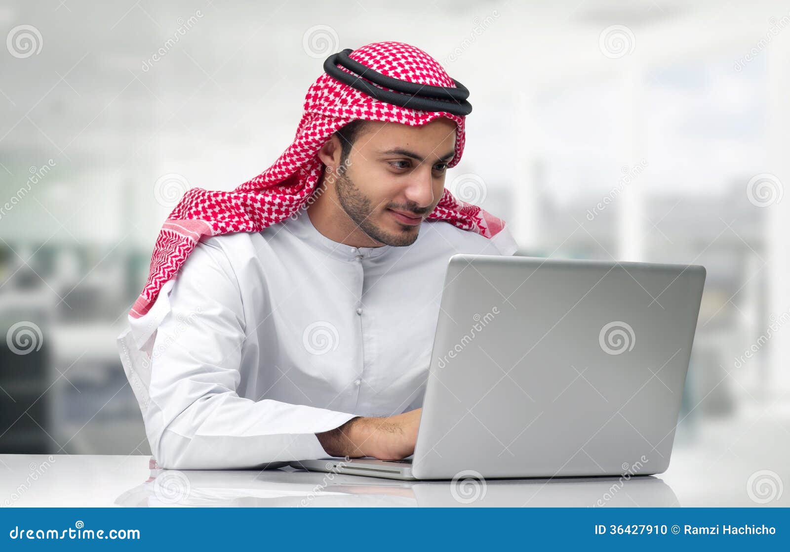 Arabian Business Man Using Notebook in the Office Stock Photo - Image ...