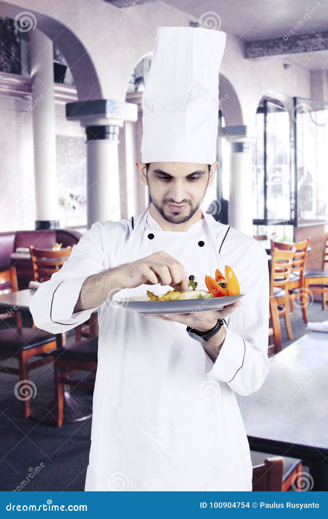 Arabian Chef Decorates a Meal in the Restaurant Stock Photo - Image of ...