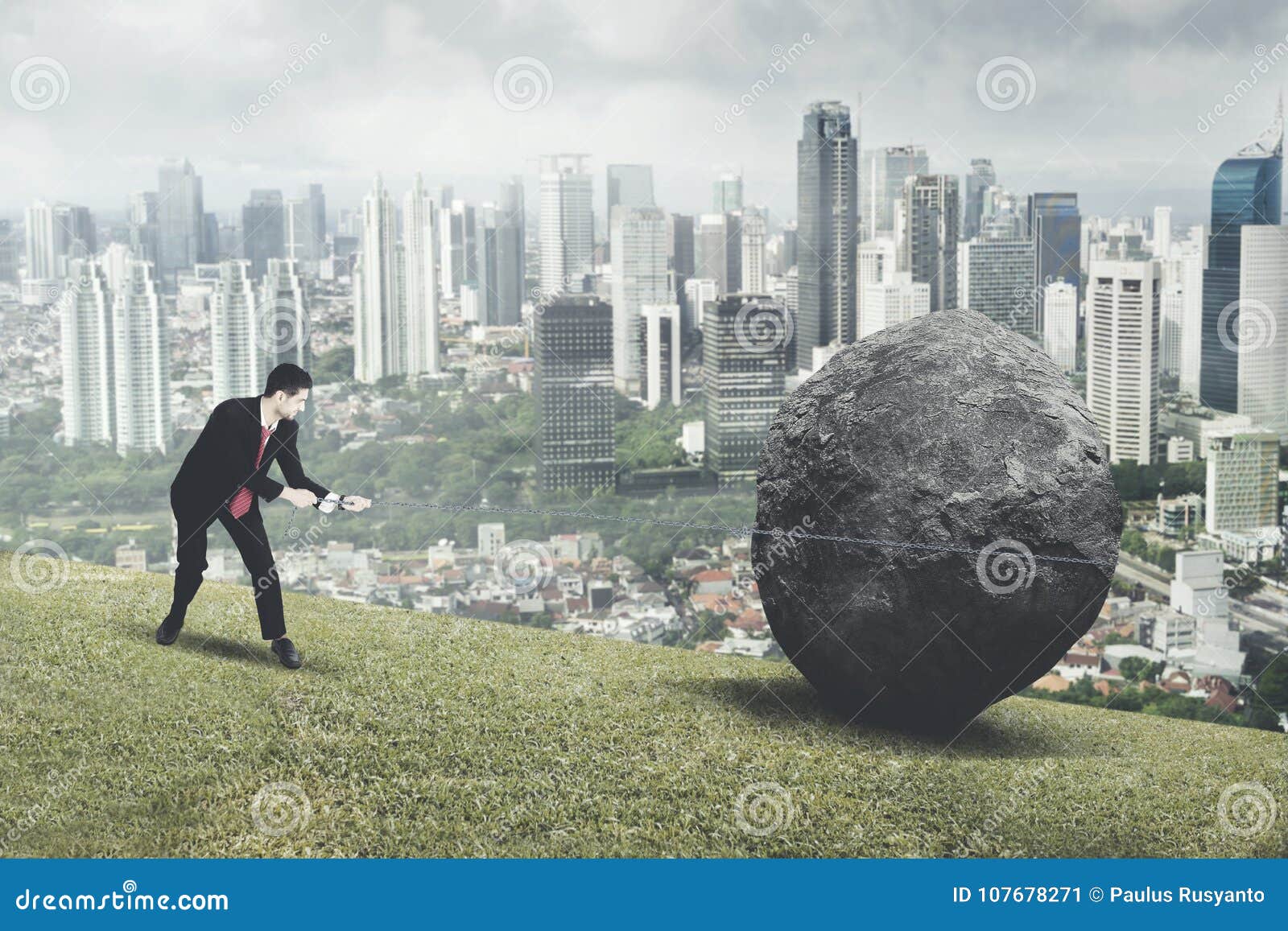 Arabian Manager Pulling A Stone On The Hill Royalty-Free Stock Photo ...
