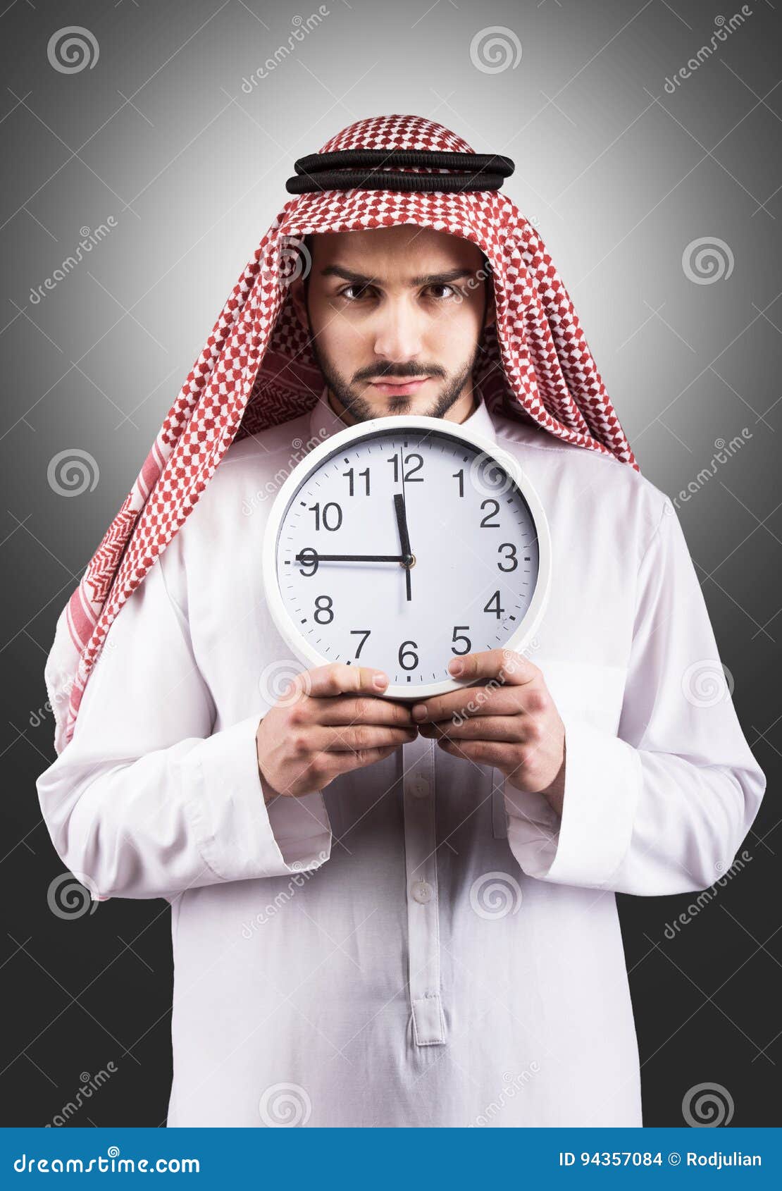 Arabian man with the clock stock photo. Image of eastern - 94357084