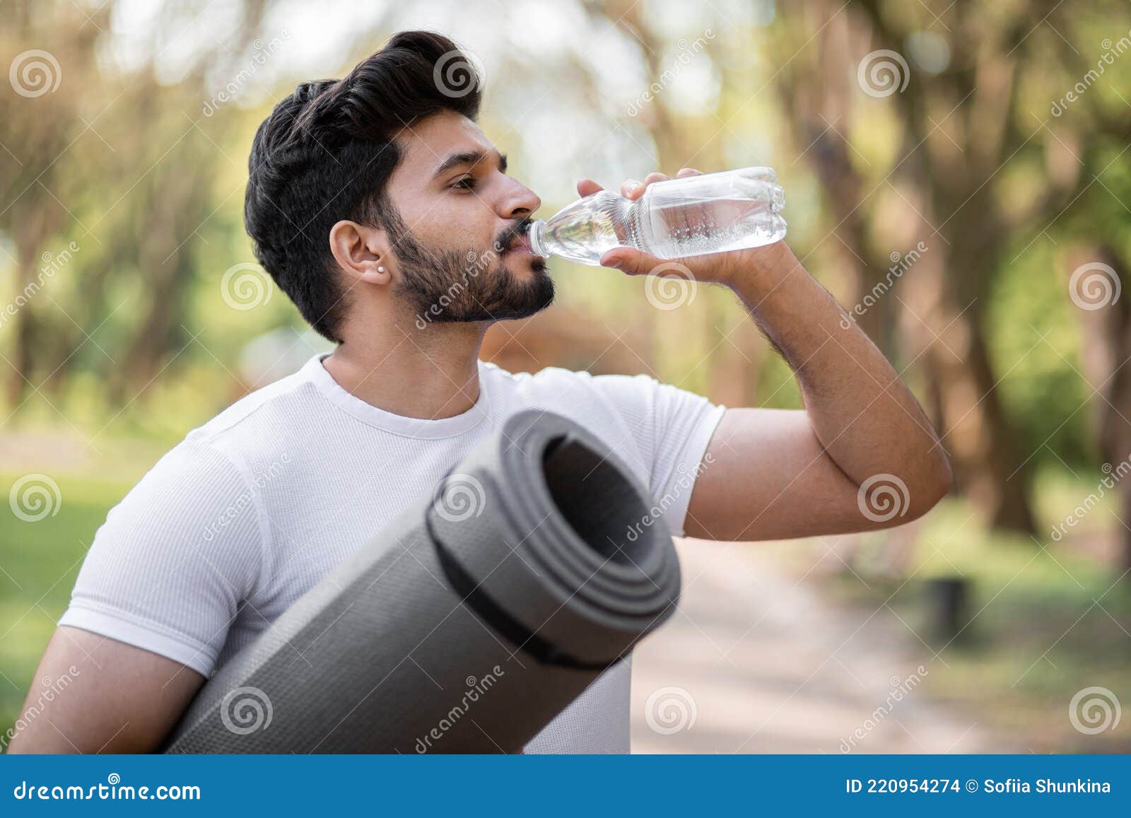 Arabian Man Refreshing with Water after Training at Park Stock Photo ...