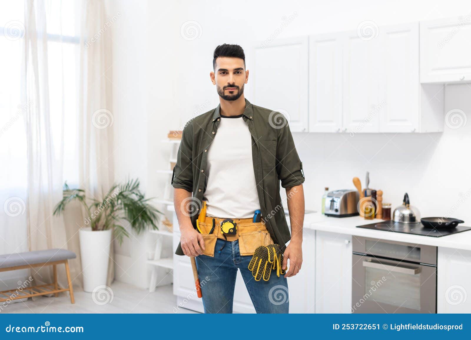 Arabian Man in Tool Belt Looking Stock Image - Image of blur, bricolage ...