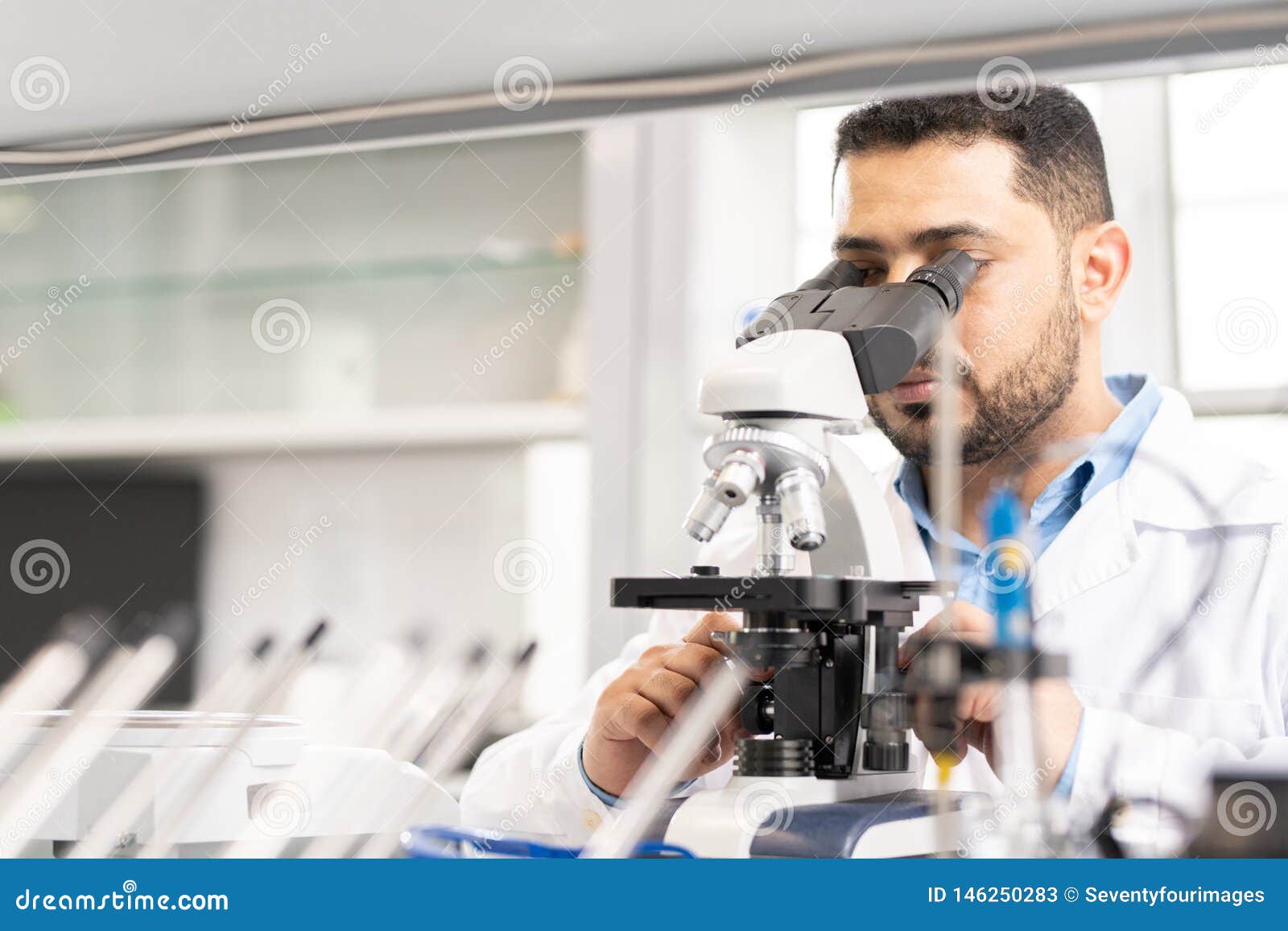 Arabian Scientist Using Microscope Stock Image - Image of examining ...