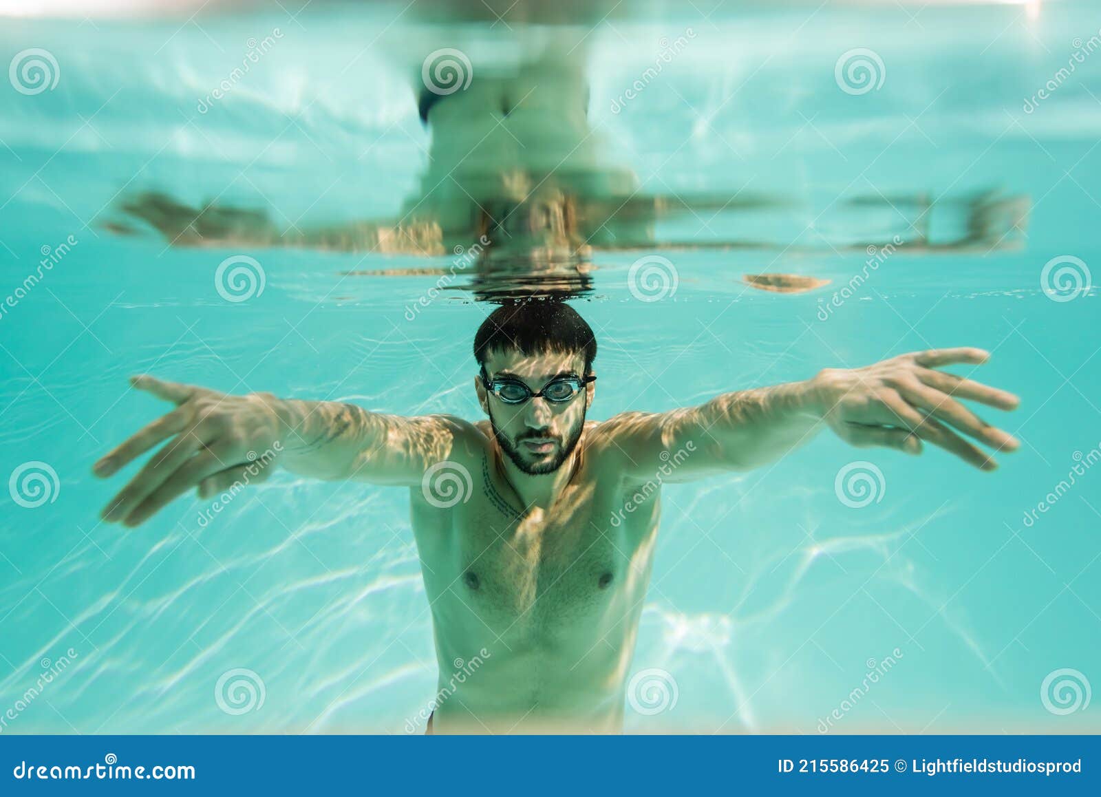 Arabian Young Swimmer Diving Underwater with Stock Image - Image of ...