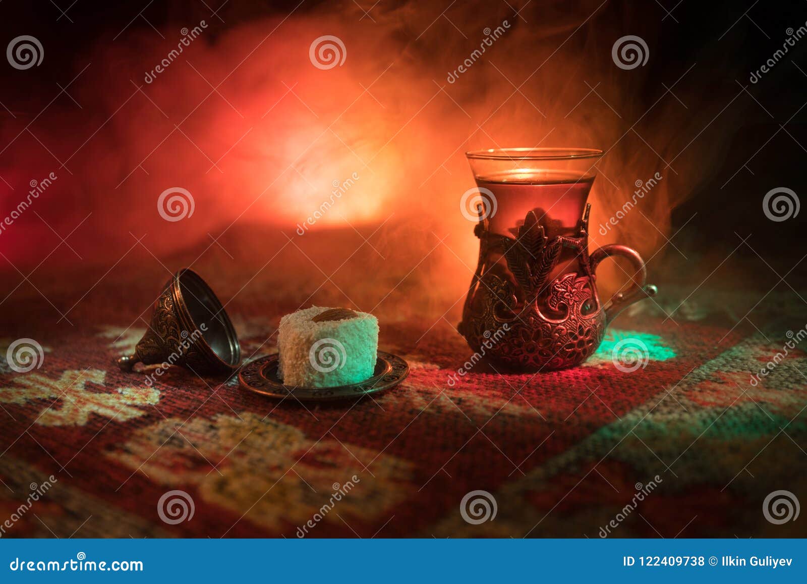 Arabian Tea in Glass with Eastern Snacks on a Carpet on Dark Background ...