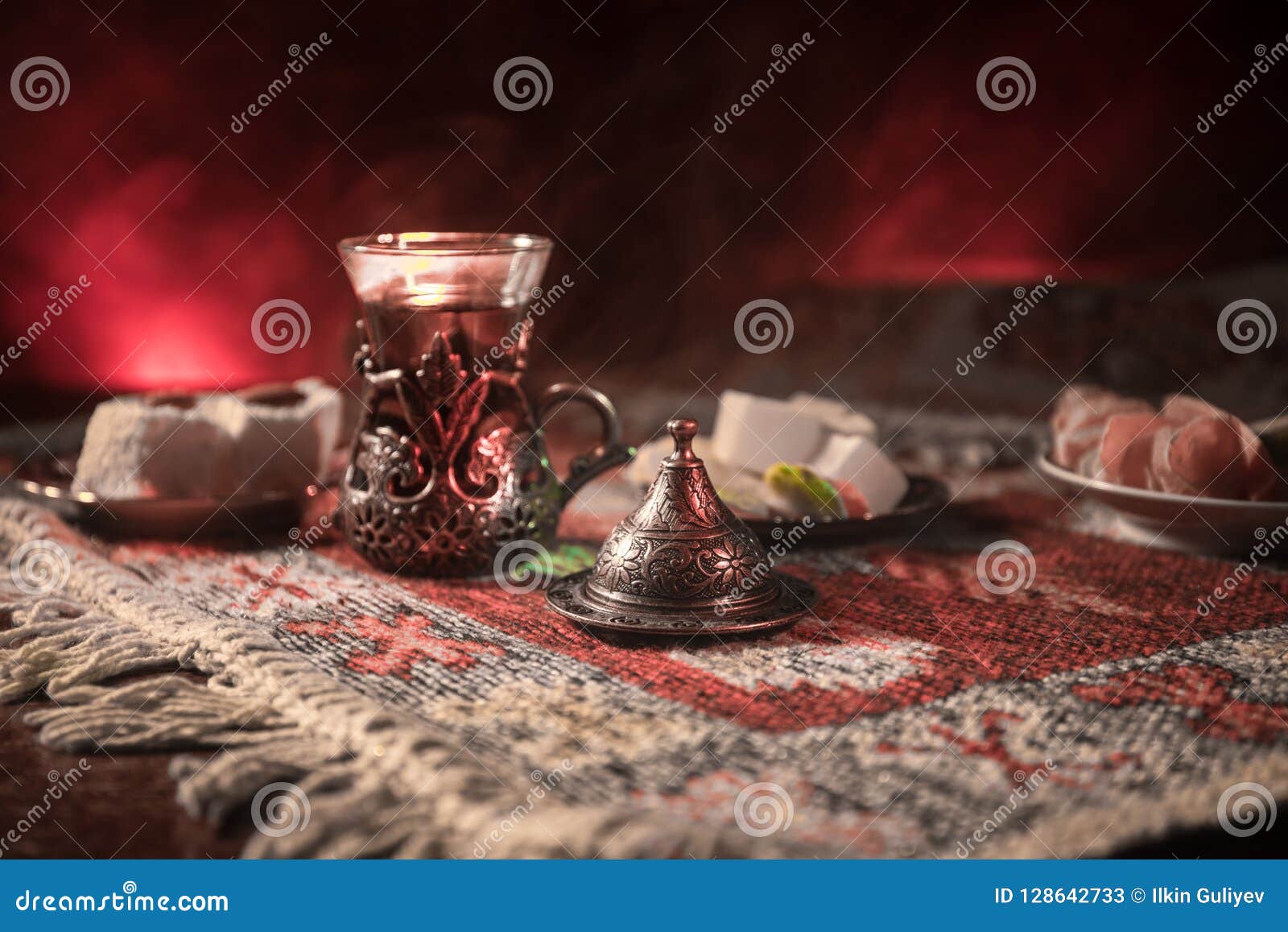 Arabian Tea in Glass with Eastern Snacks on a Carpet on Dark Background ...