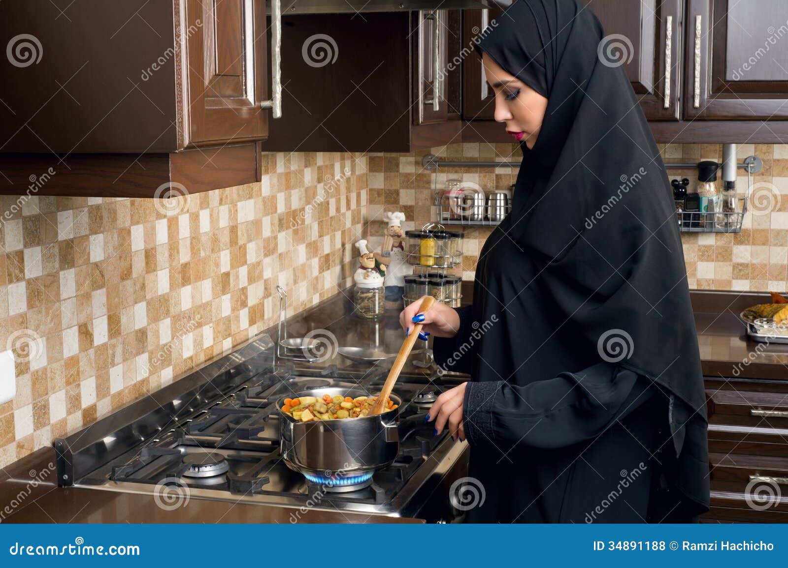 Arabian Woman Cooking Stew in the Kitchen Stock Photo - Image of ...