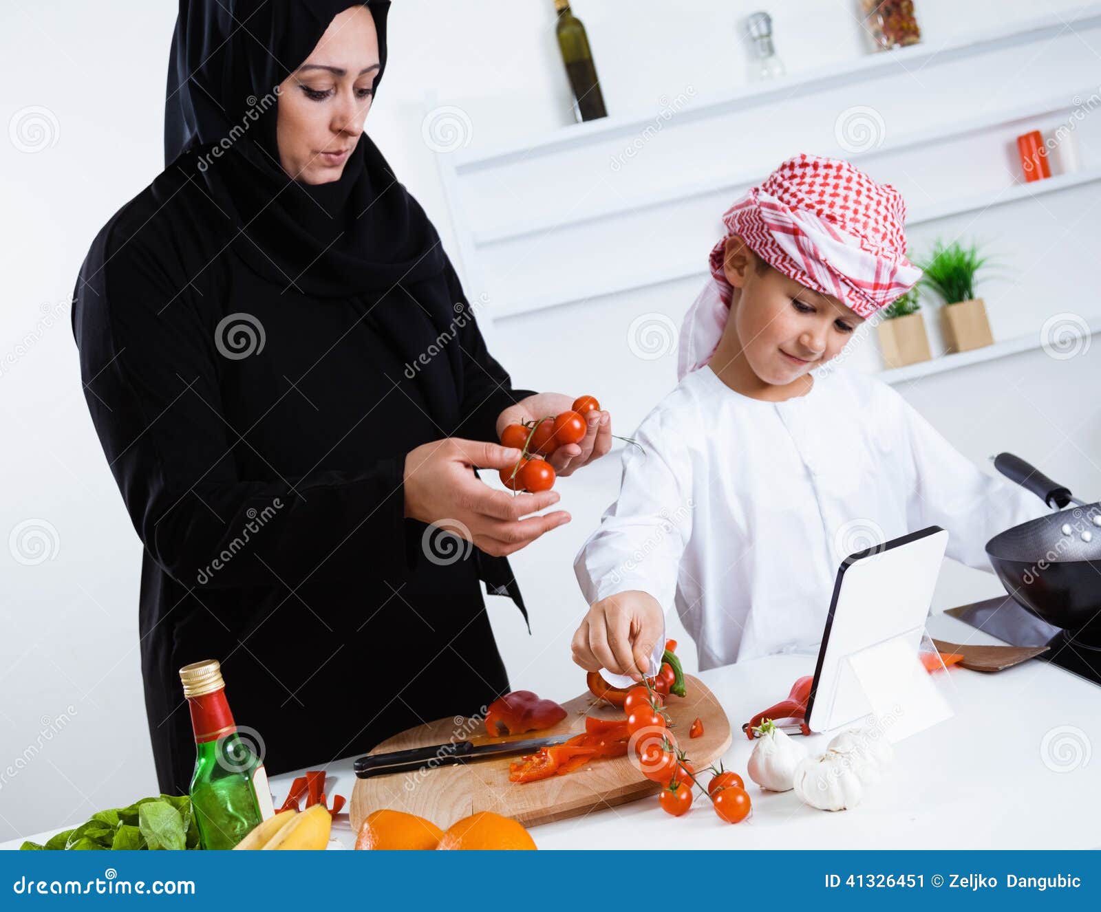 Arabic Child in the Kitchen with His Mother Stock Image - Image of ...