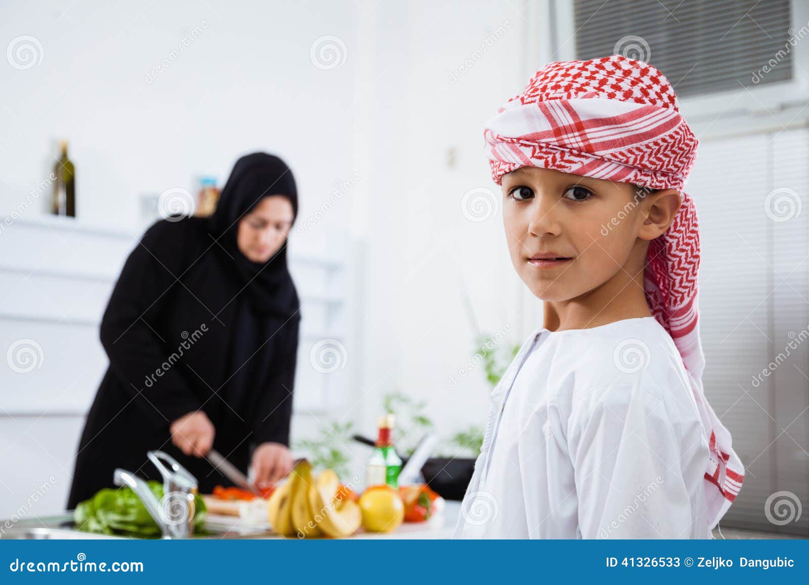Arabic Child in the Kitchen with His Mother Stock Image - Image of ...