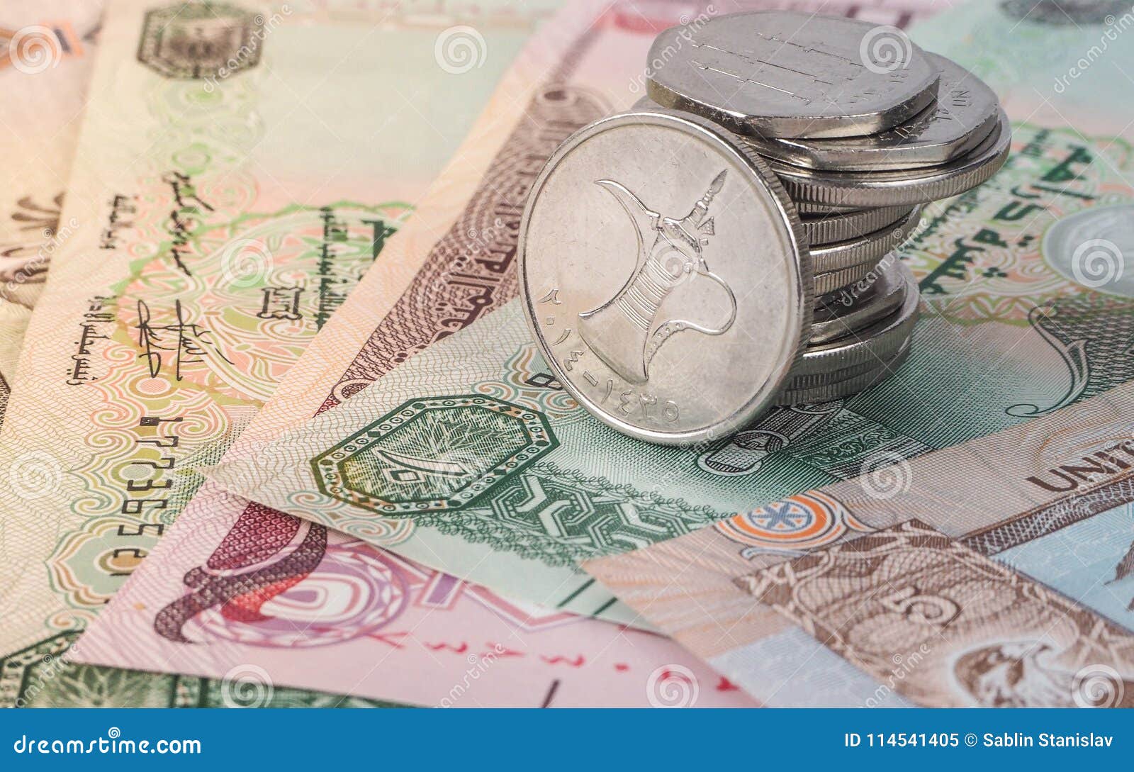 Arabic Coins of Dirhams. Curled Banknotes in His Hands. Stock Image ...