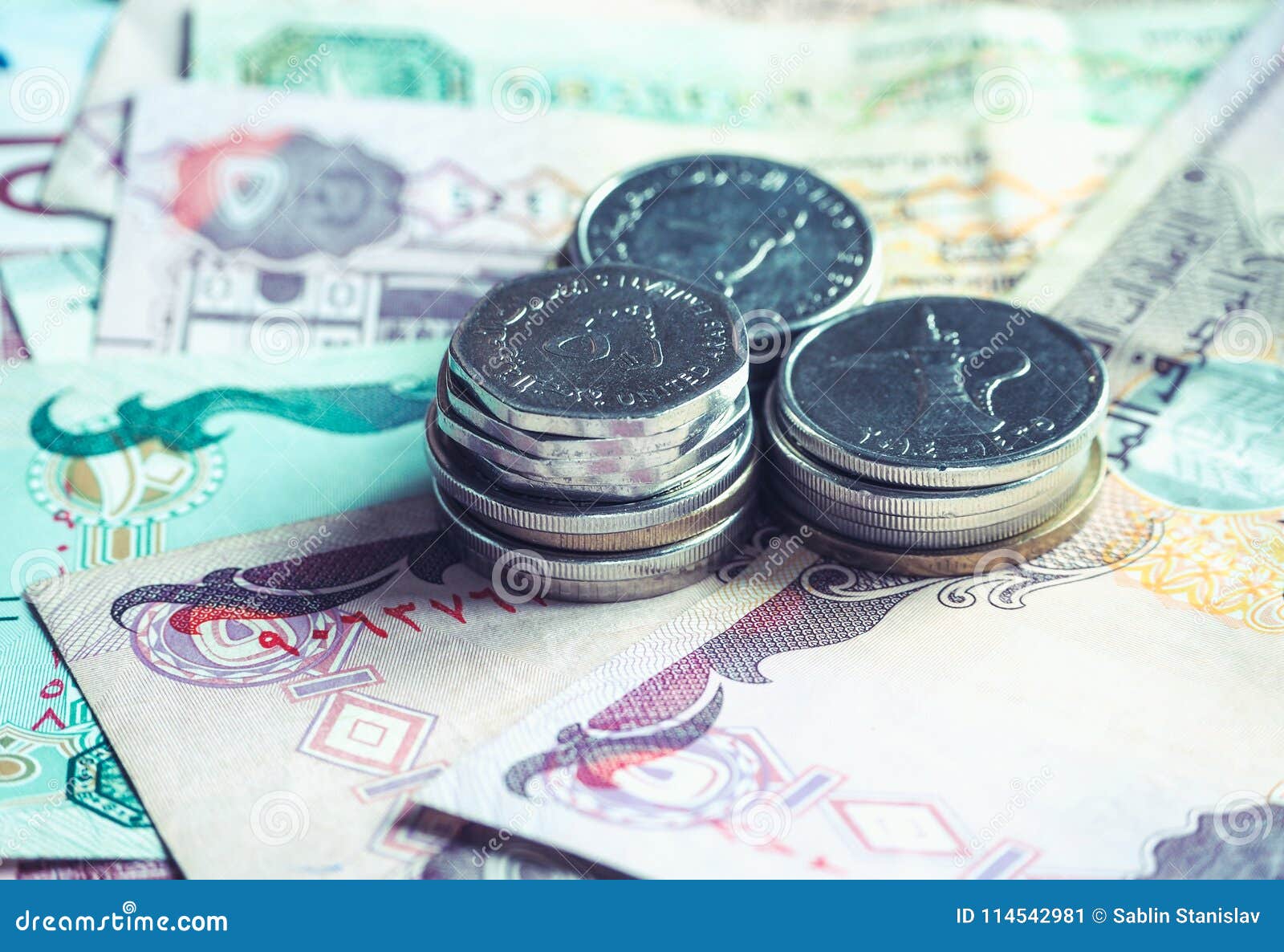 Arabic Coins of Dirhams. Curled Banknotes in His Hands. Stock Image ...