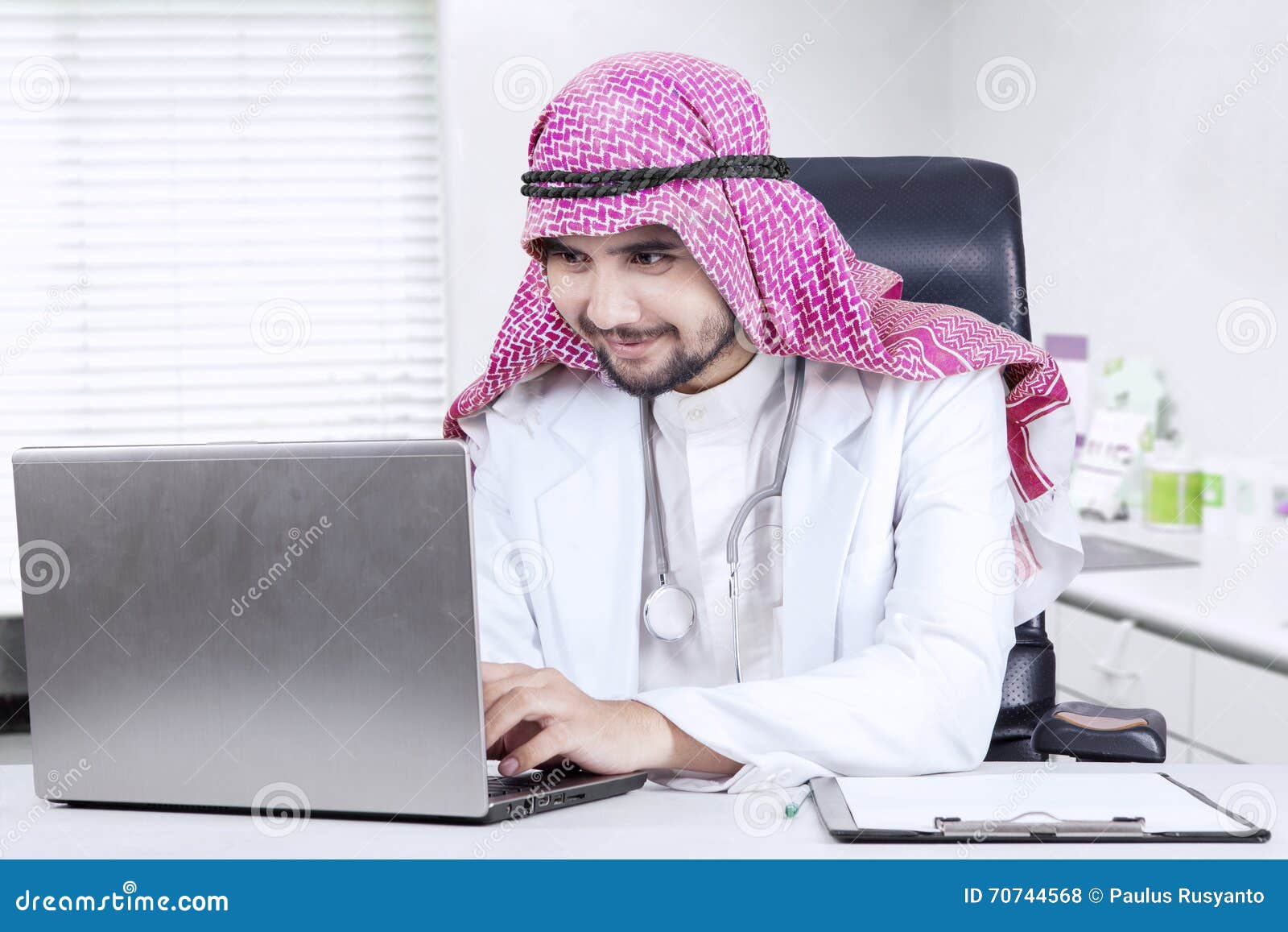 Arabic Doctor Using Laptop on Desk Stock Photo - Image of arabian ...