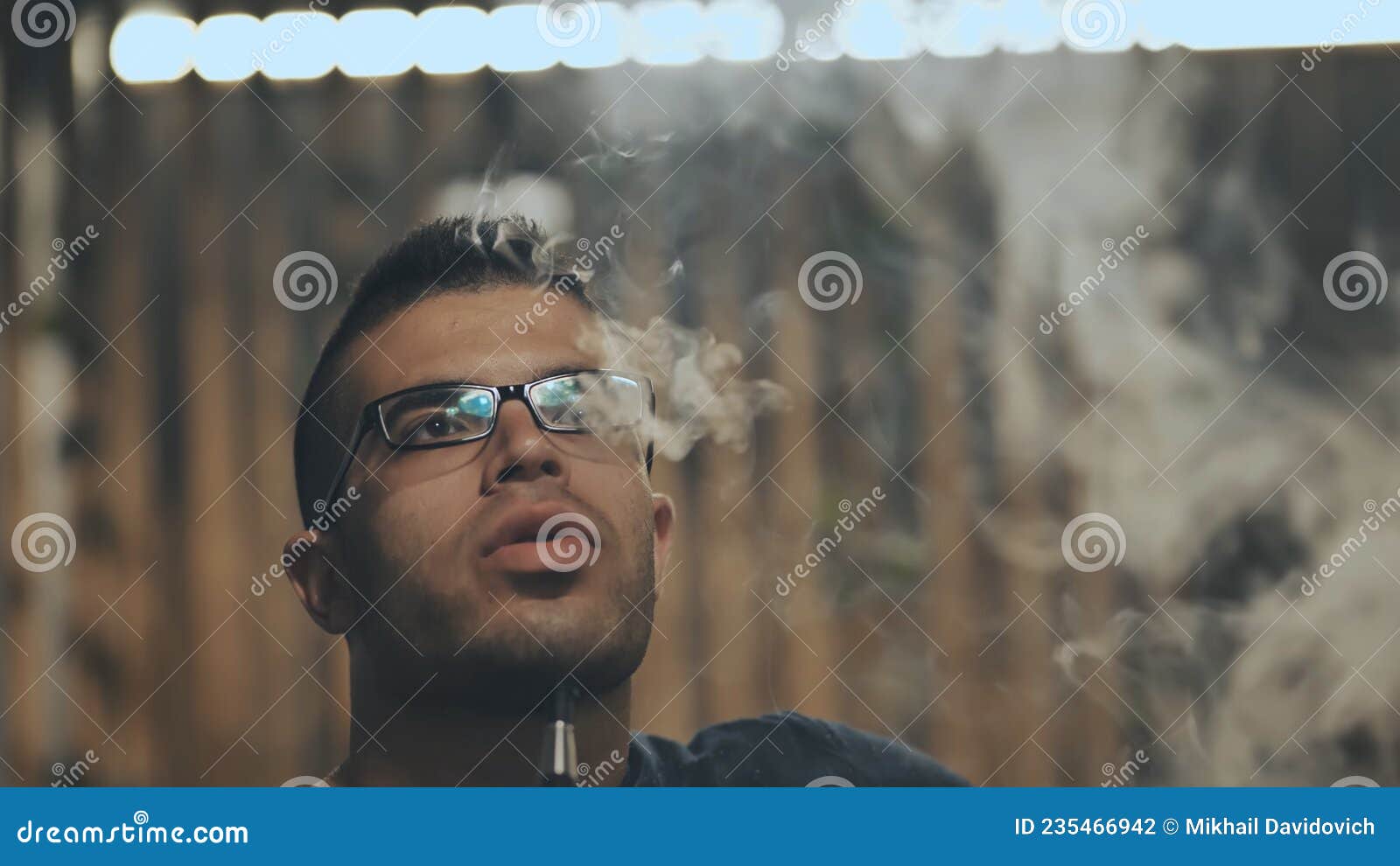 Arabic Jordanian Young Man Smokes a Hookah. Stock Photo - Image of dark ...
