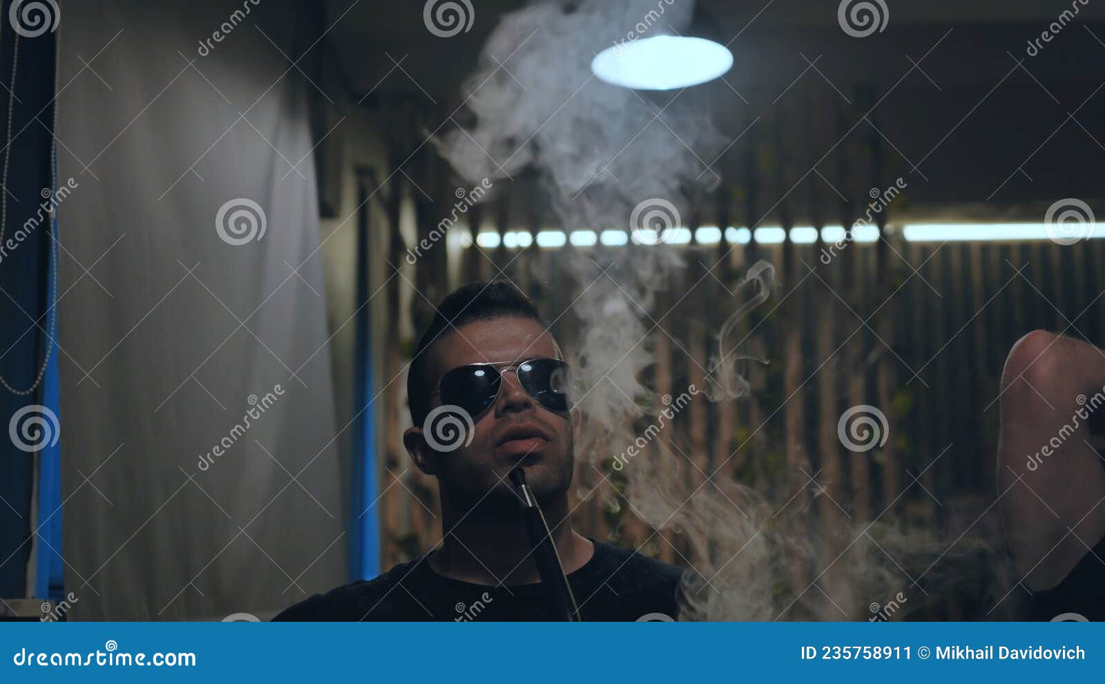 Arabic Jordanian Young Man Smokes a Hookah. Stock Image - Image of ...