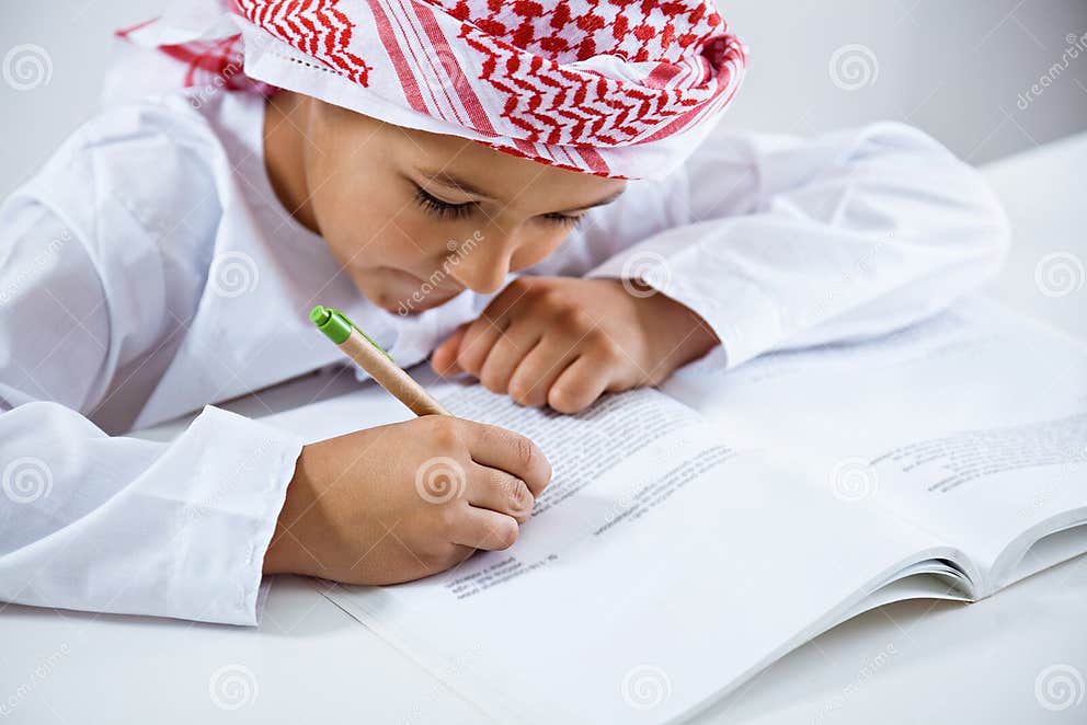 Arabic Little Boy Doing Homework Stock Photo - Image of child, book ...