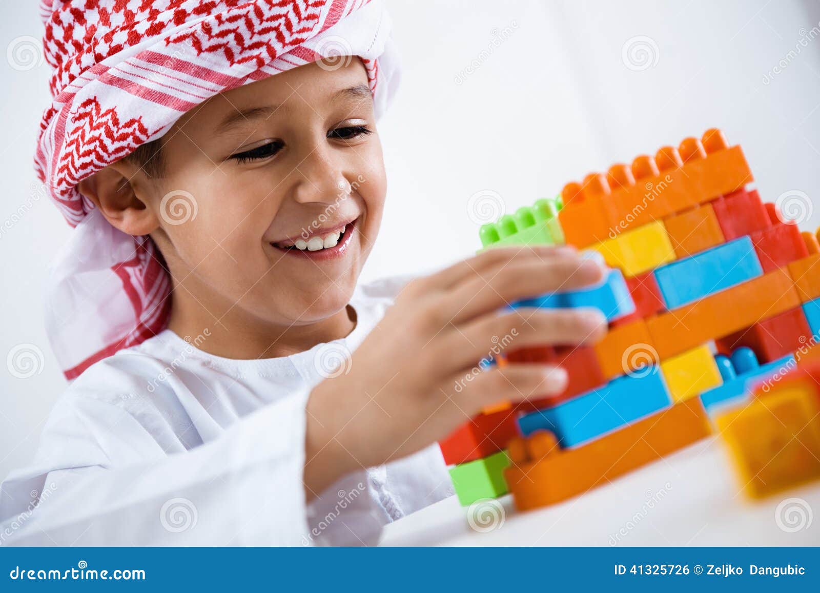 Arabic little boy playing stock photo. Image of blocks - 41325726