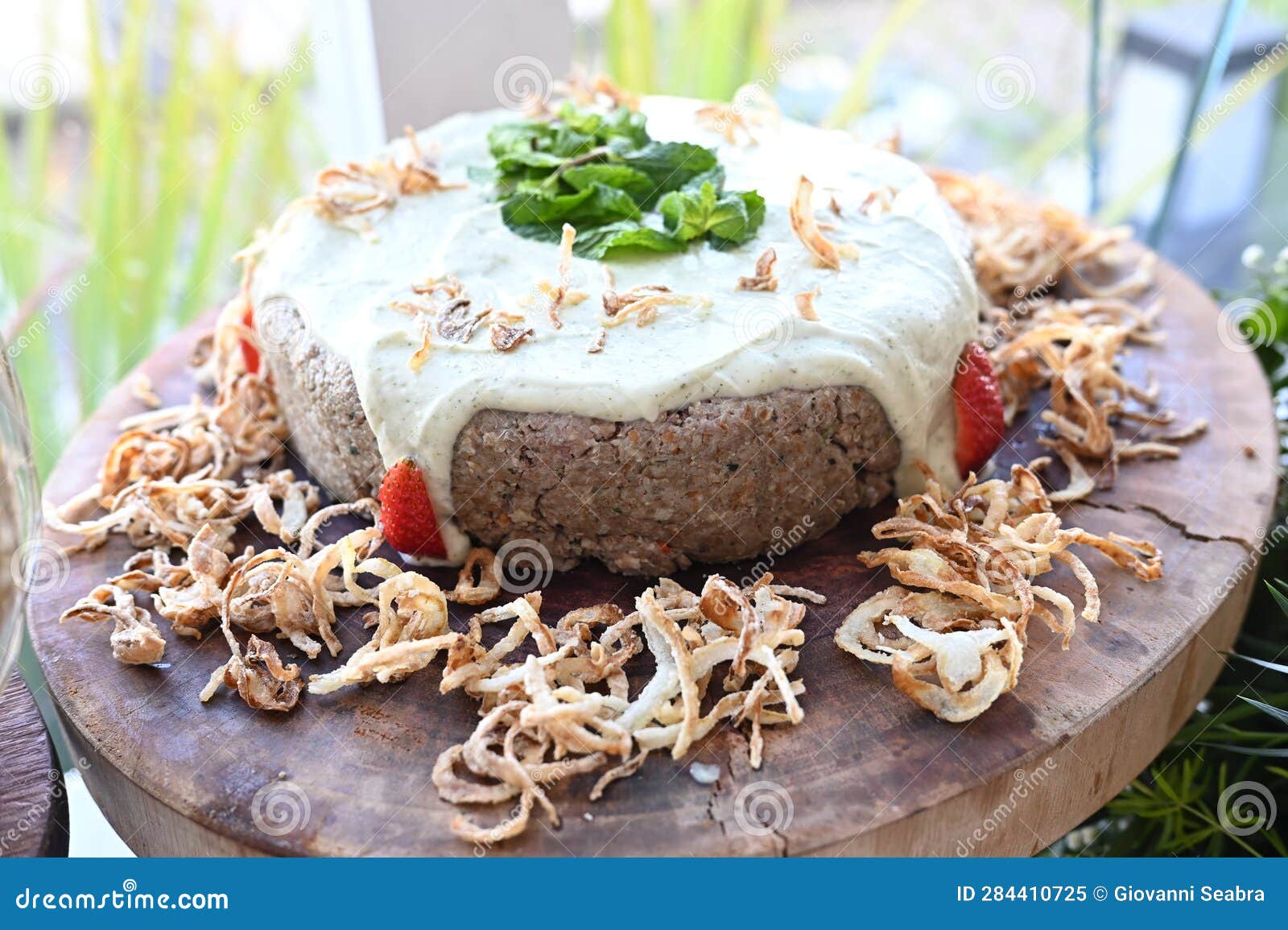 Arabic Meat Kibbeh with Wheat and Cream on Top Stock Image - Image of ...
