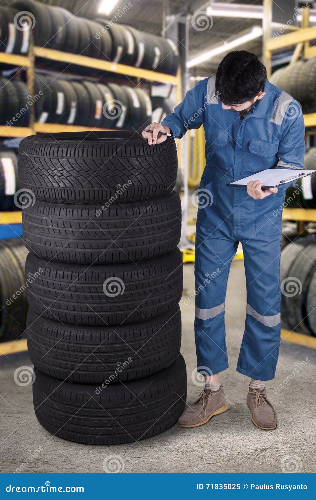 Arabic Mechanic Checks the Tires in Workshop Stock Image - Image of ...
