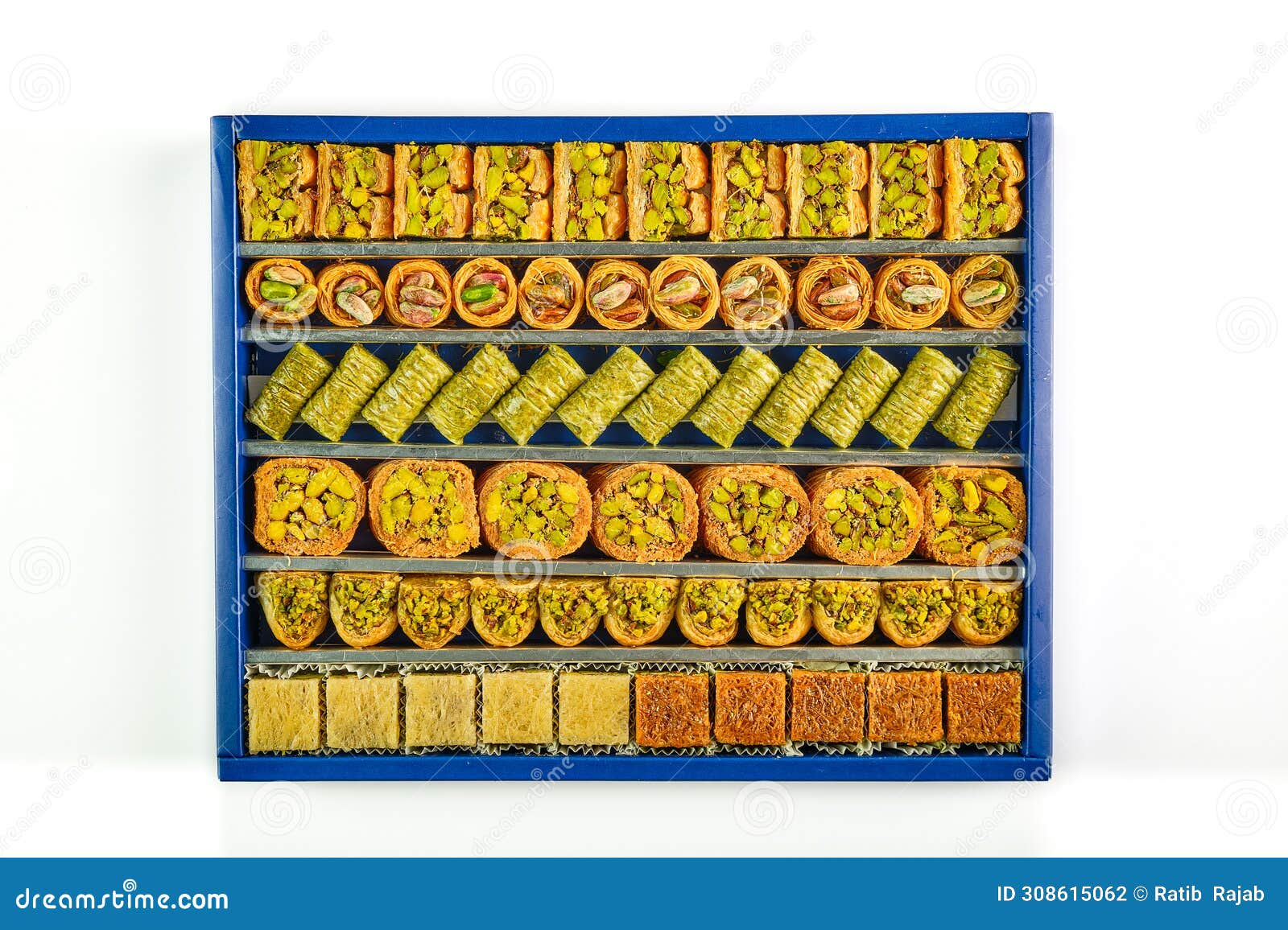 A Box of Assorted Arabic Sweets with Pistachios Stock Photo - Image of ...