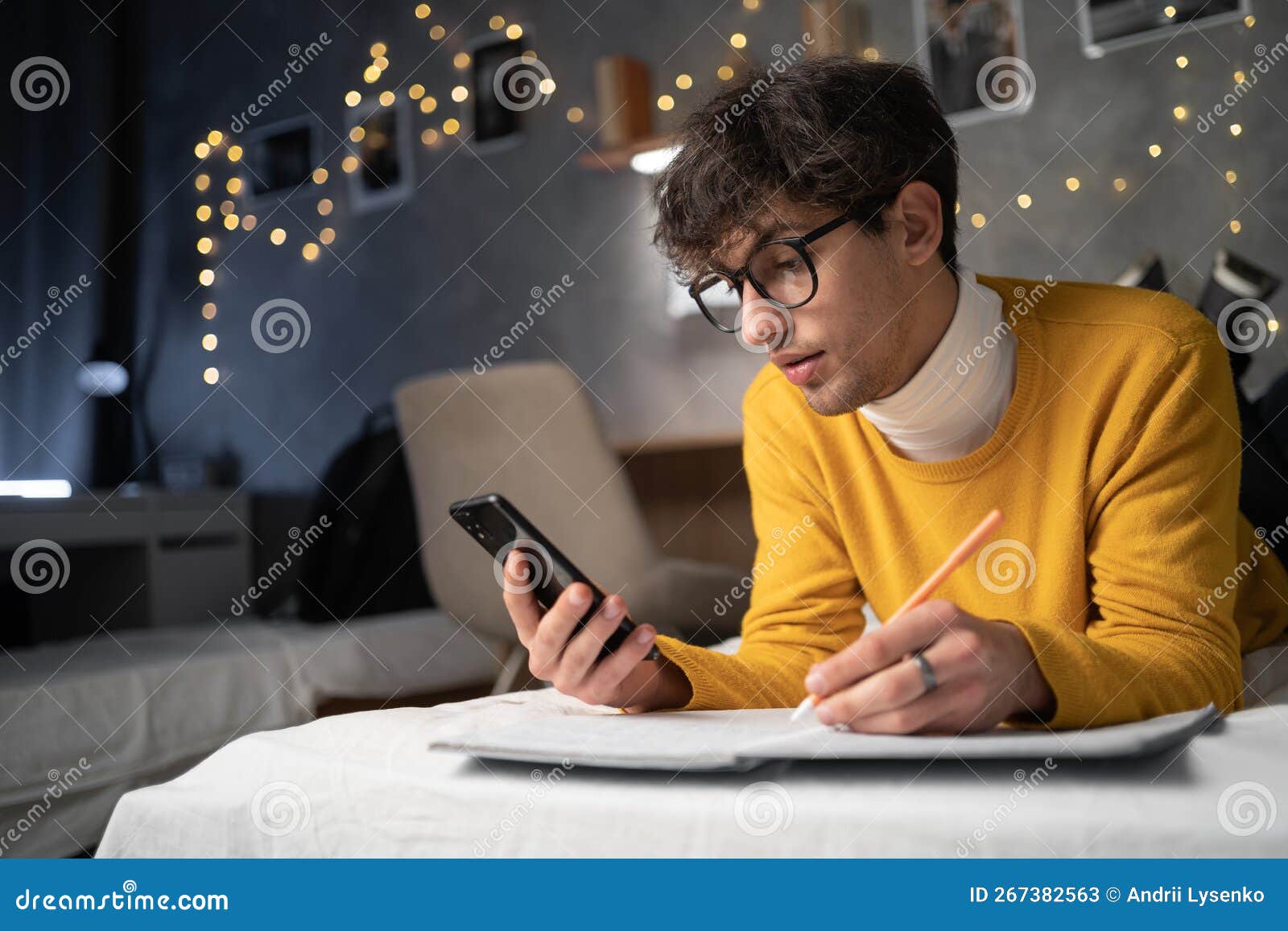 Arabic Young Guy College Student Holding Smartphone Studying on Cell ...