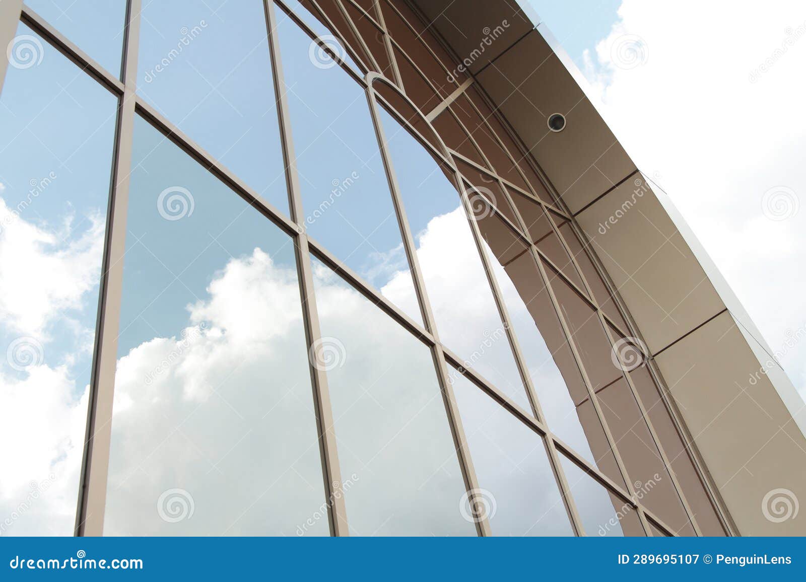 Arch Arc Windows on Beige Mall Storefront with Reflection of Clouds and ...
