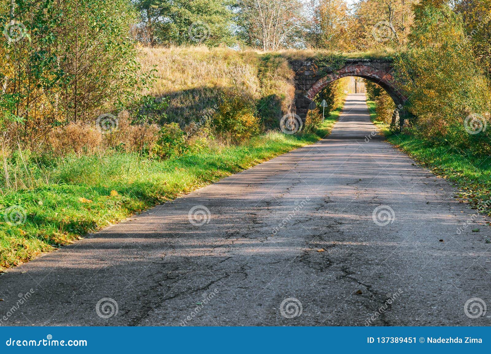 Arch bridge over the road stock image. Image of road - 137389451