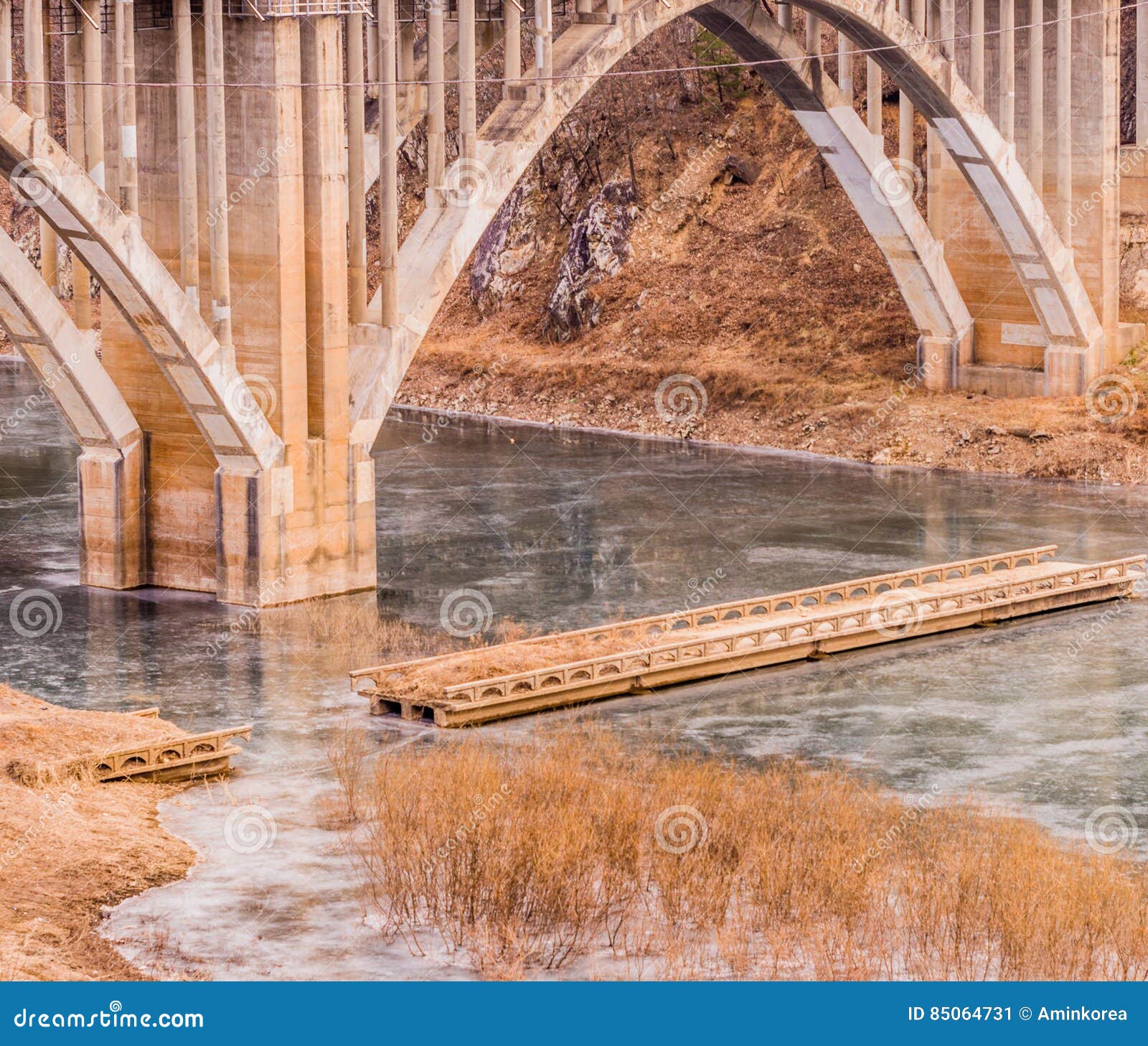 Arch Bridge with Spandrel Columns Spanning a River Stock Image - Image ...