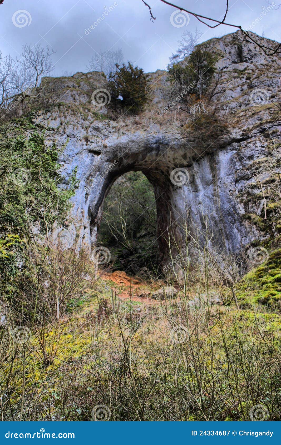 Arch formed in a rockface stock image. Image of natural - 24334687