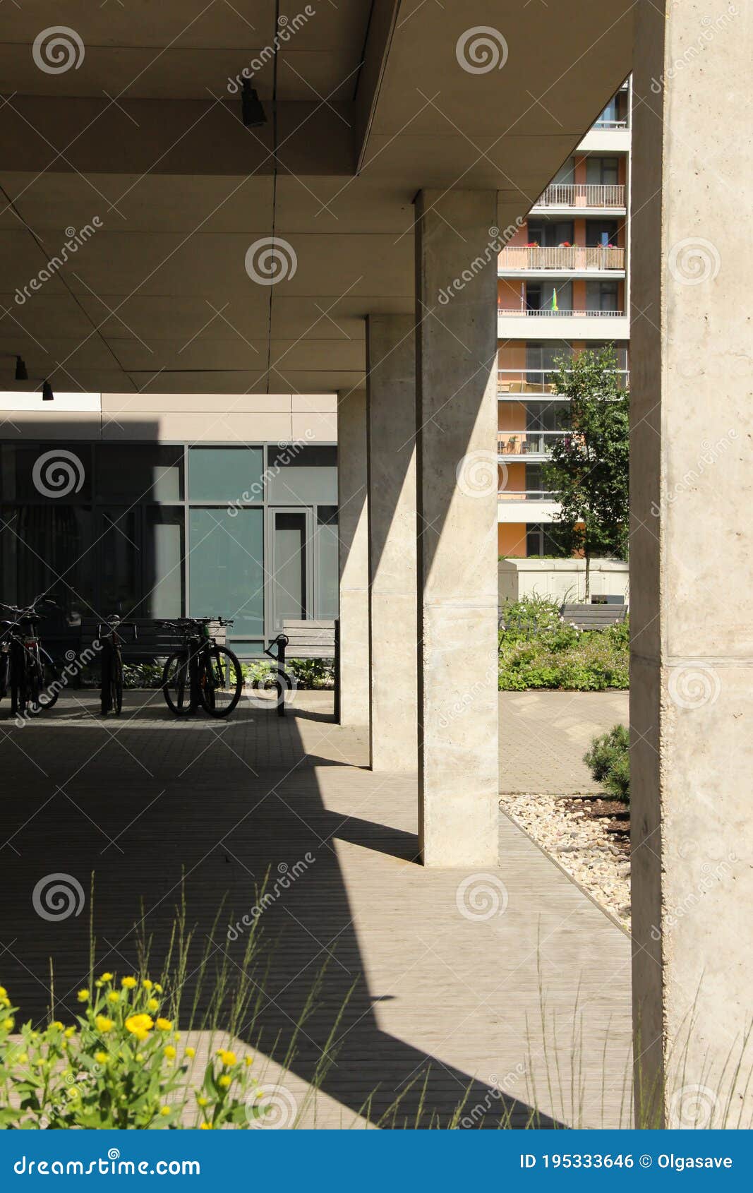 An Arch Passage Below the Modern Building. Rectangular Columns Hold the ...