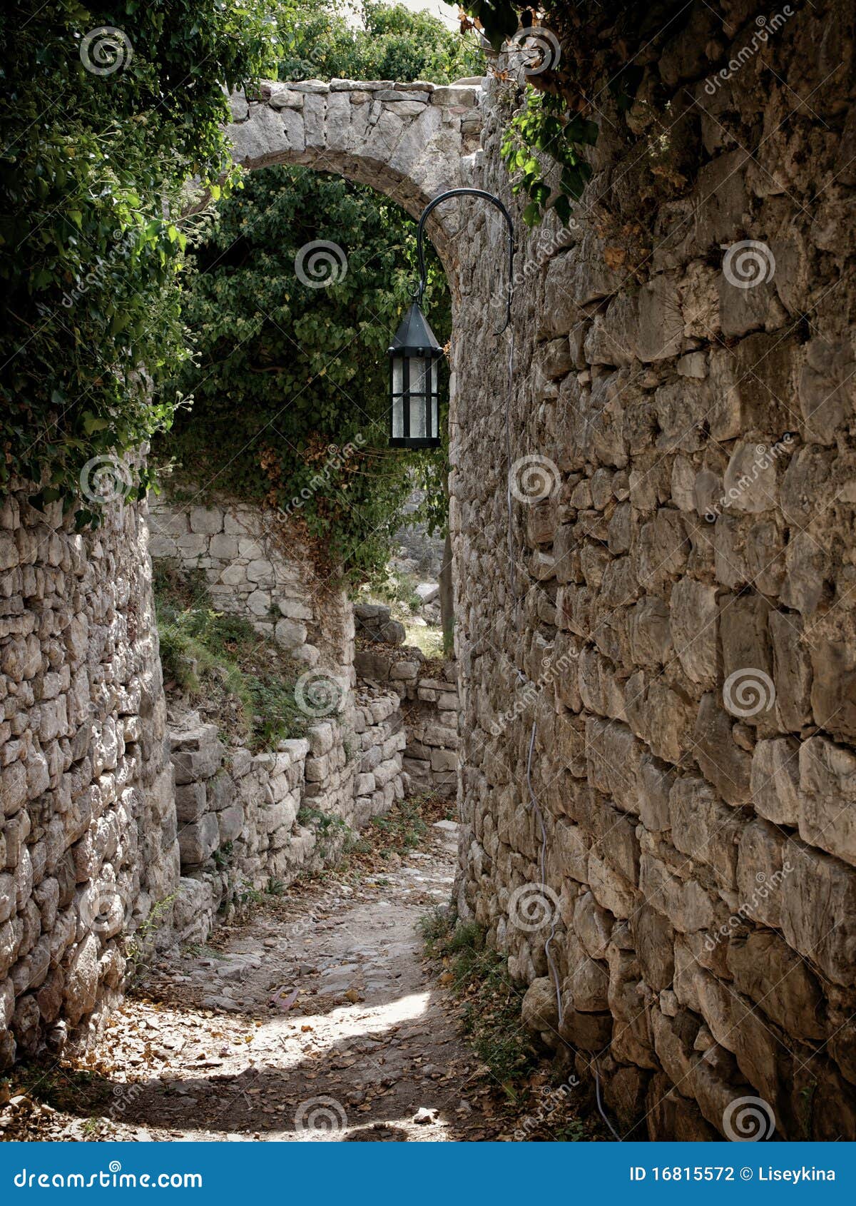 Arch pathway in old town stock photo. Image of lantern - 16815572