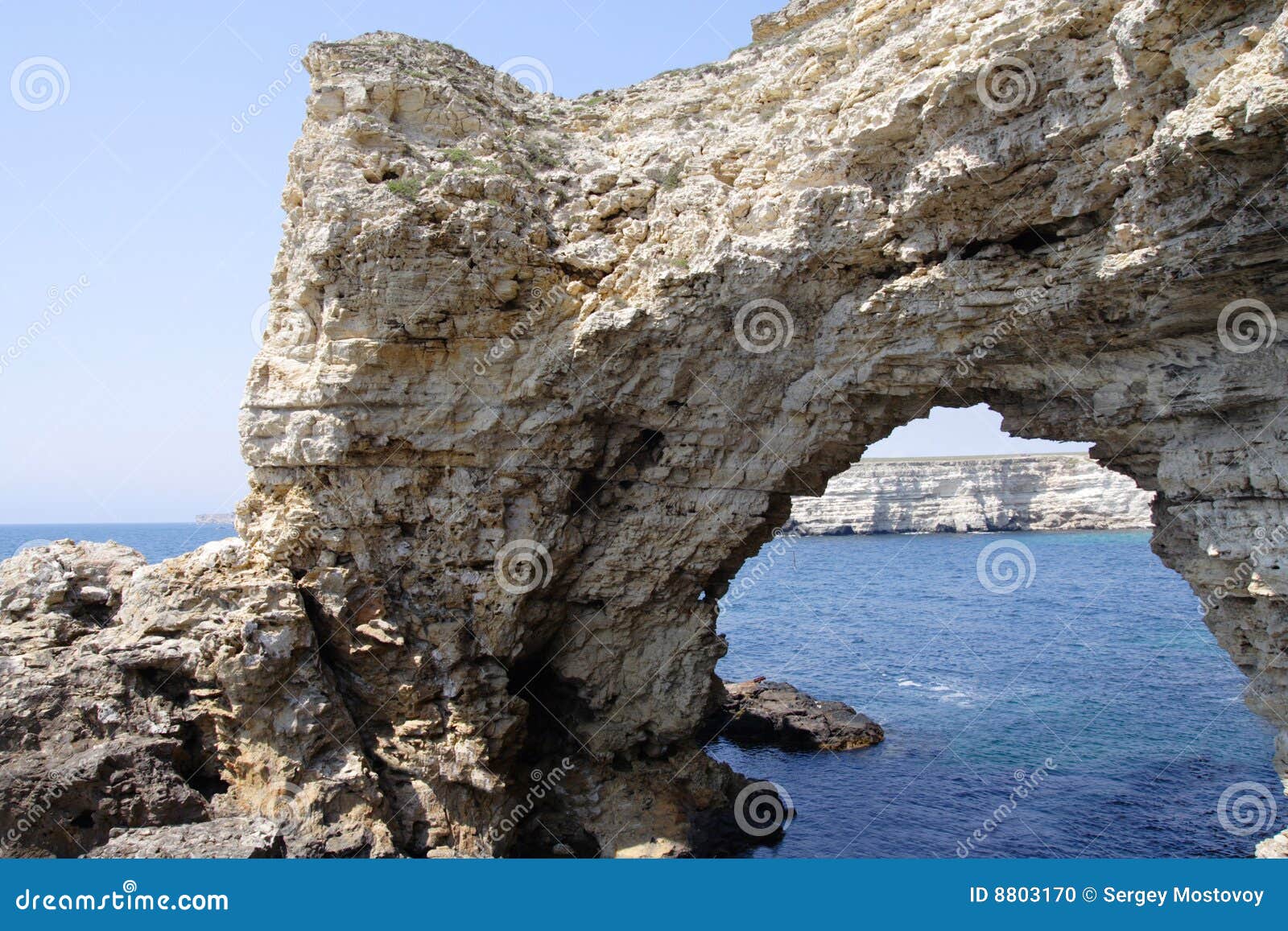 Arch in a rocky cliff stock photo. Image of cliff, summer - 8803170