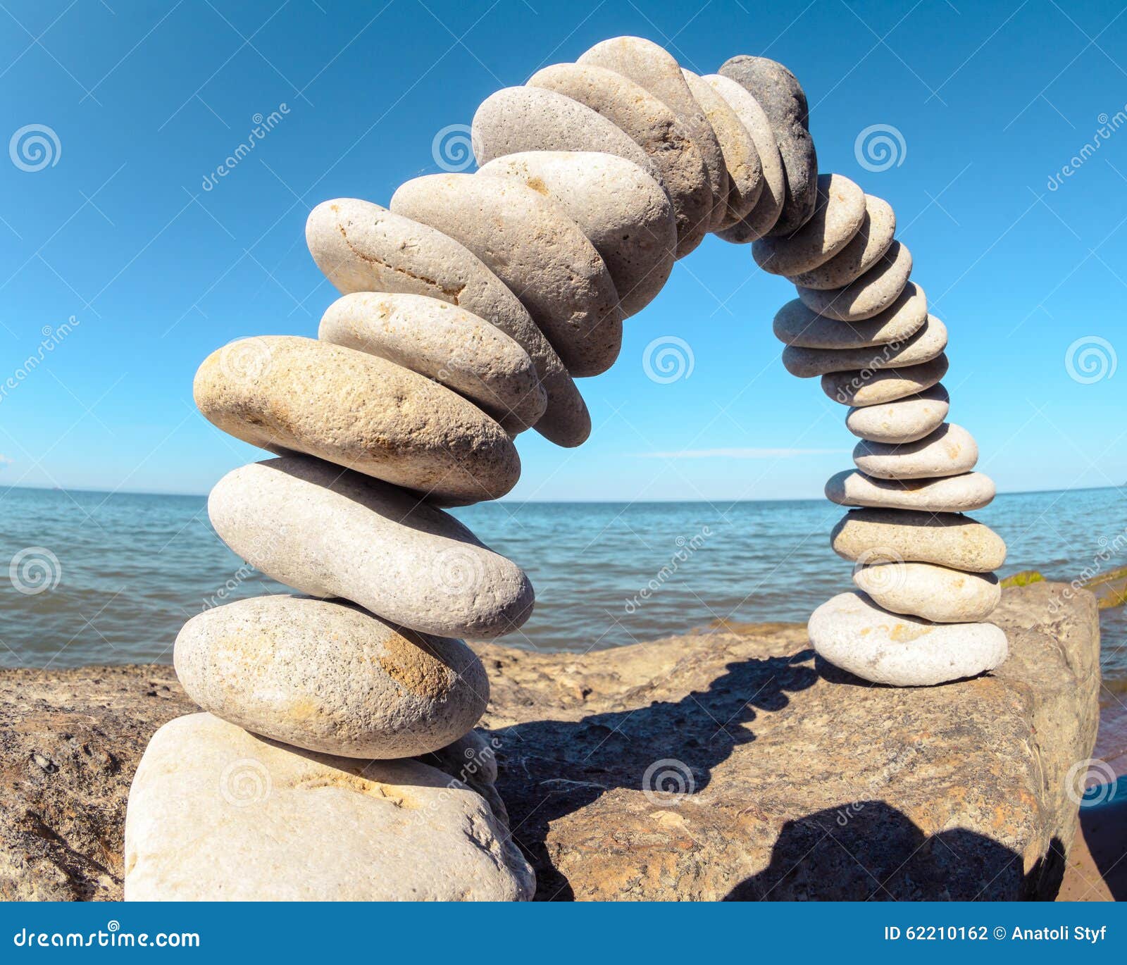 Arch on seashore stock photo. Image of pile, pebble, heap - 62210162