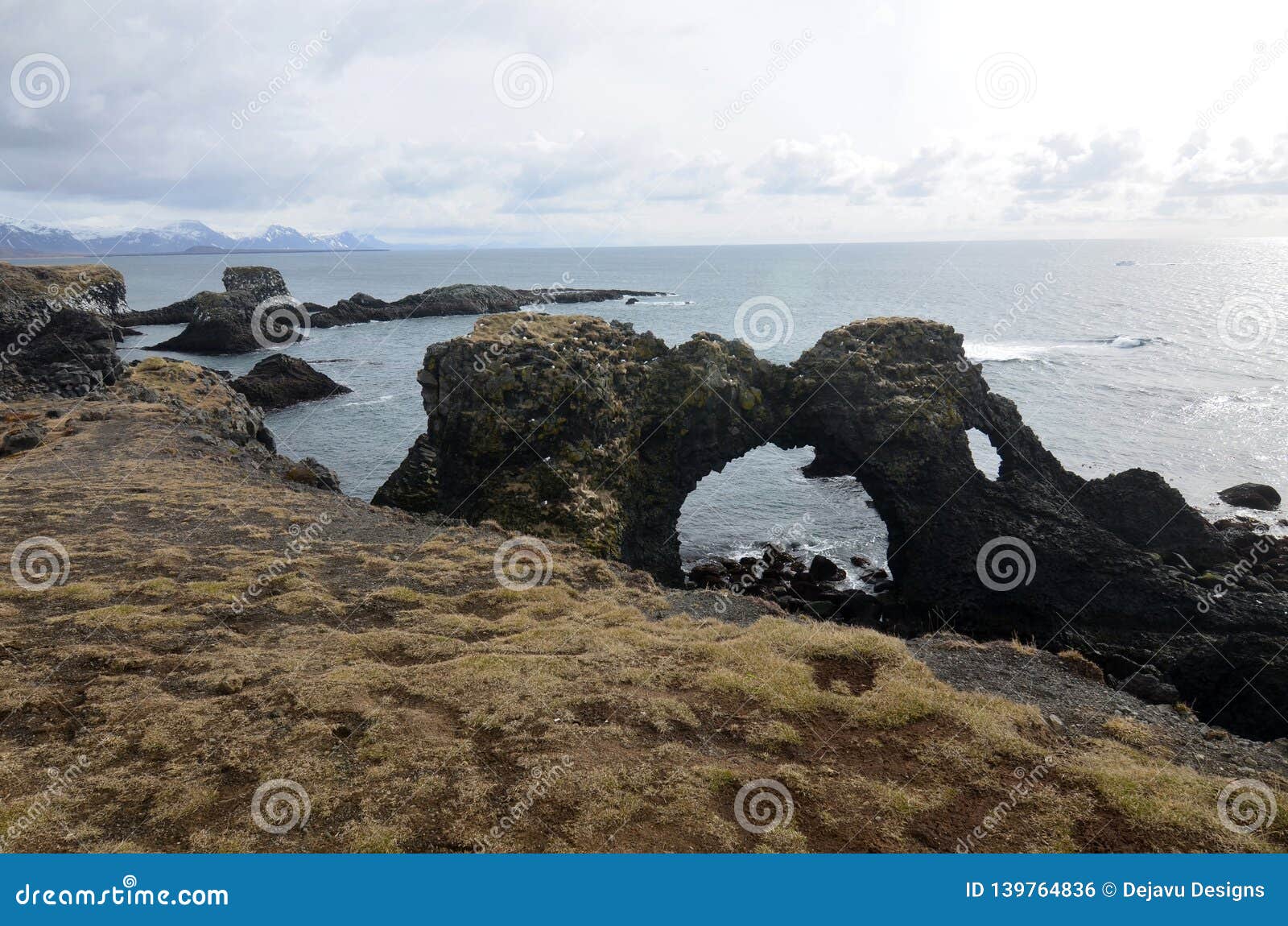 Arch Shaped Rock Located on the Coast of Arnarstapi Stock Photo - Image ...