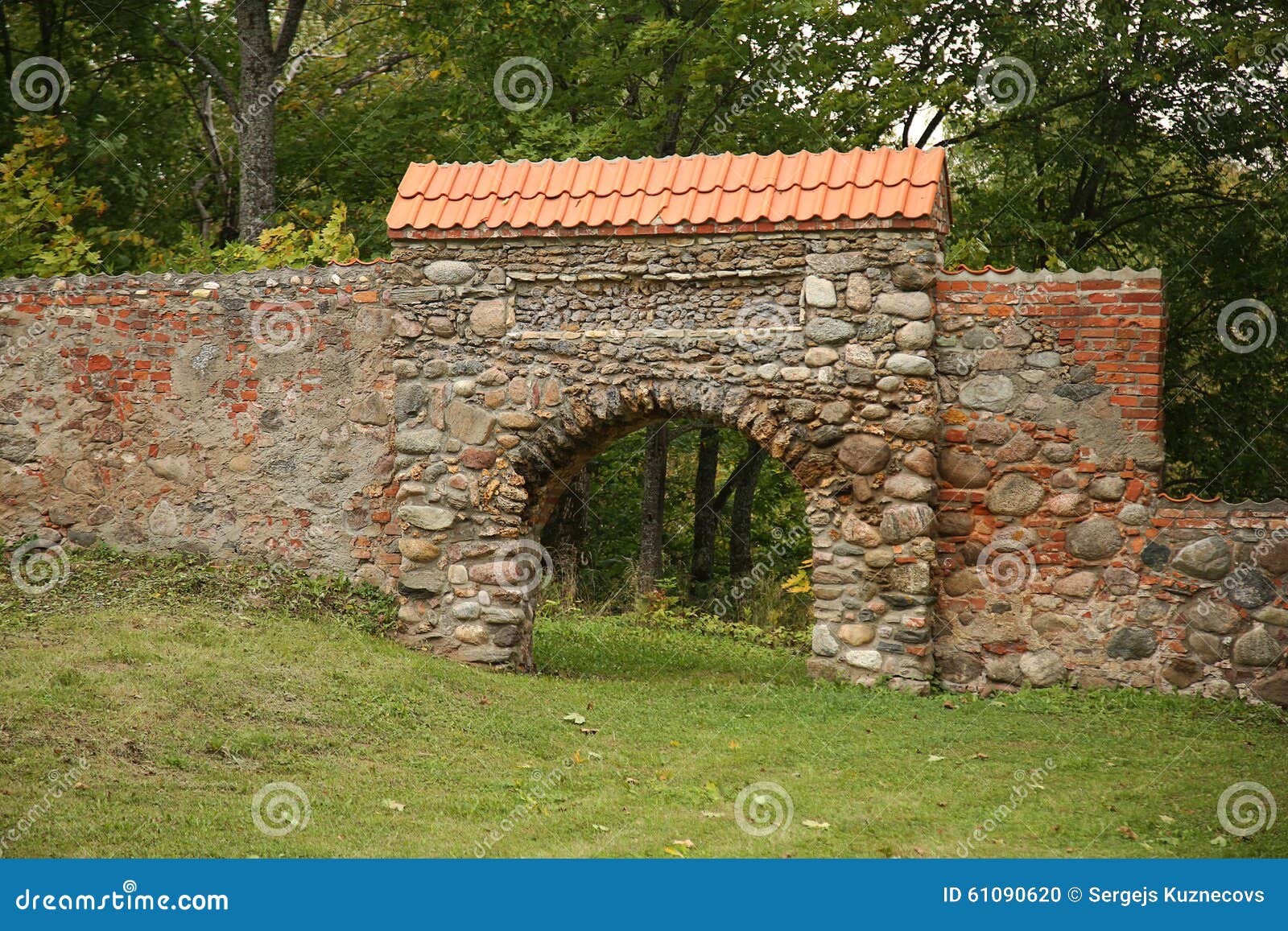Arch in stone wall stock photo. Image of surface, fragment - 61090620