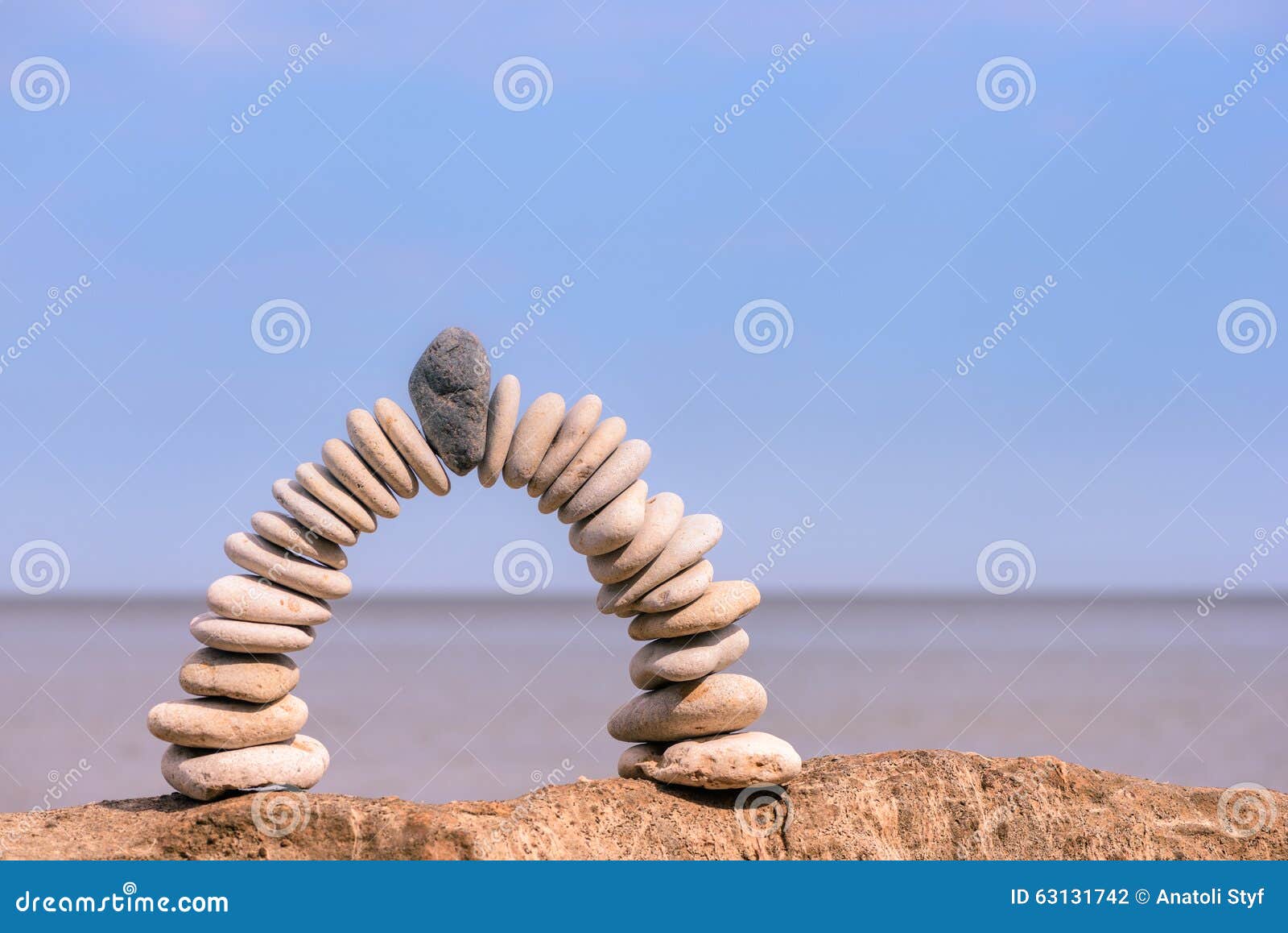 Arch of white pebbles stock photo. Image of balance, pebble - 63131742