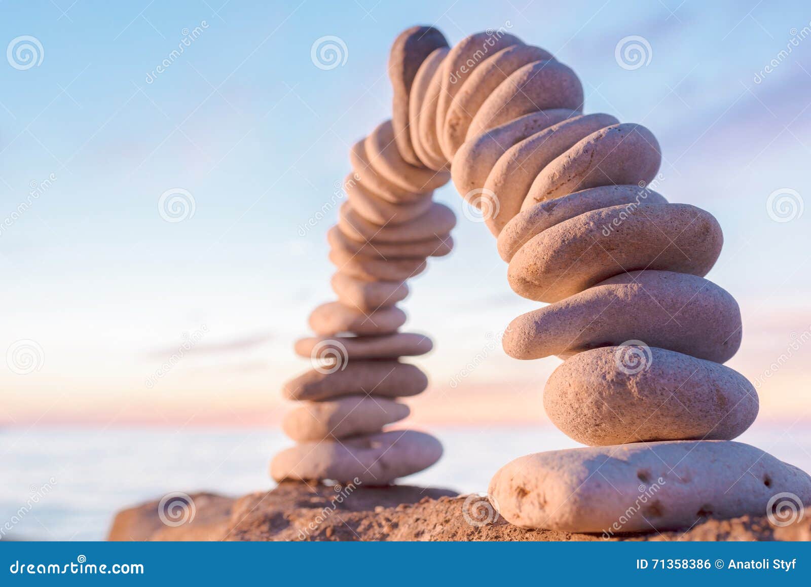 Arch of white pebbles stock photo. Image of exactitude - 71358386