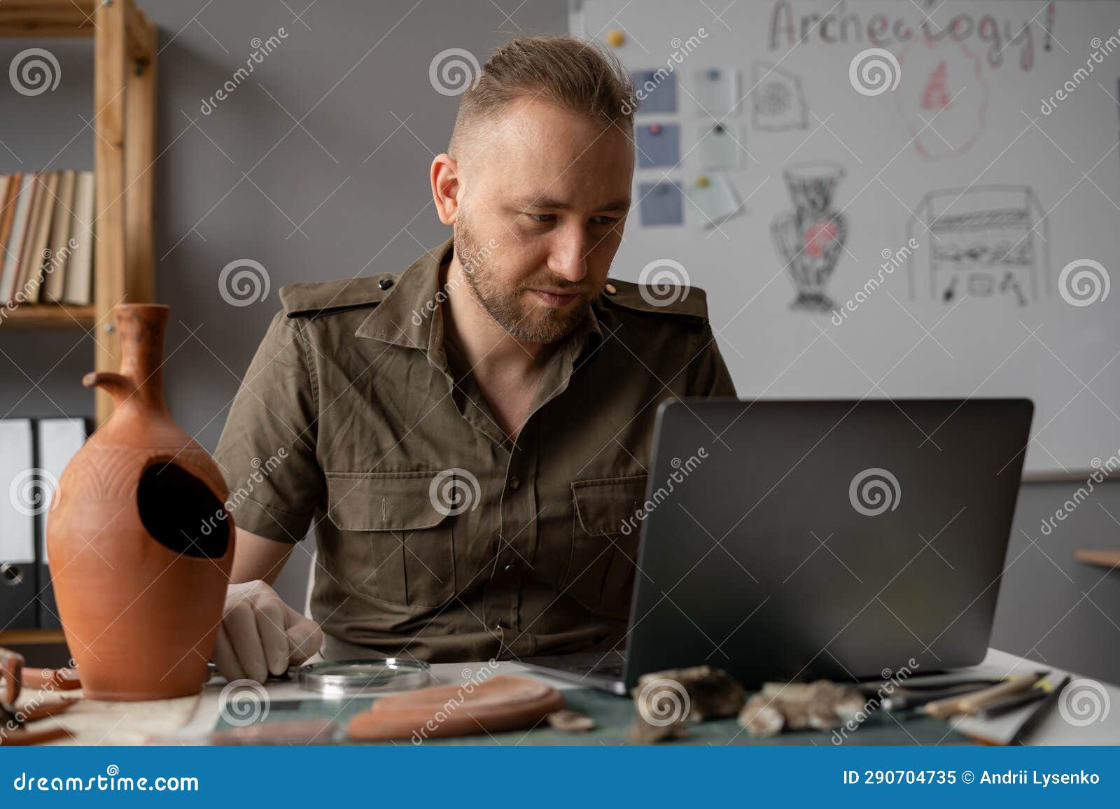 Archaeological Office. Male Archaeologist Doing Research, Using Laptop ...