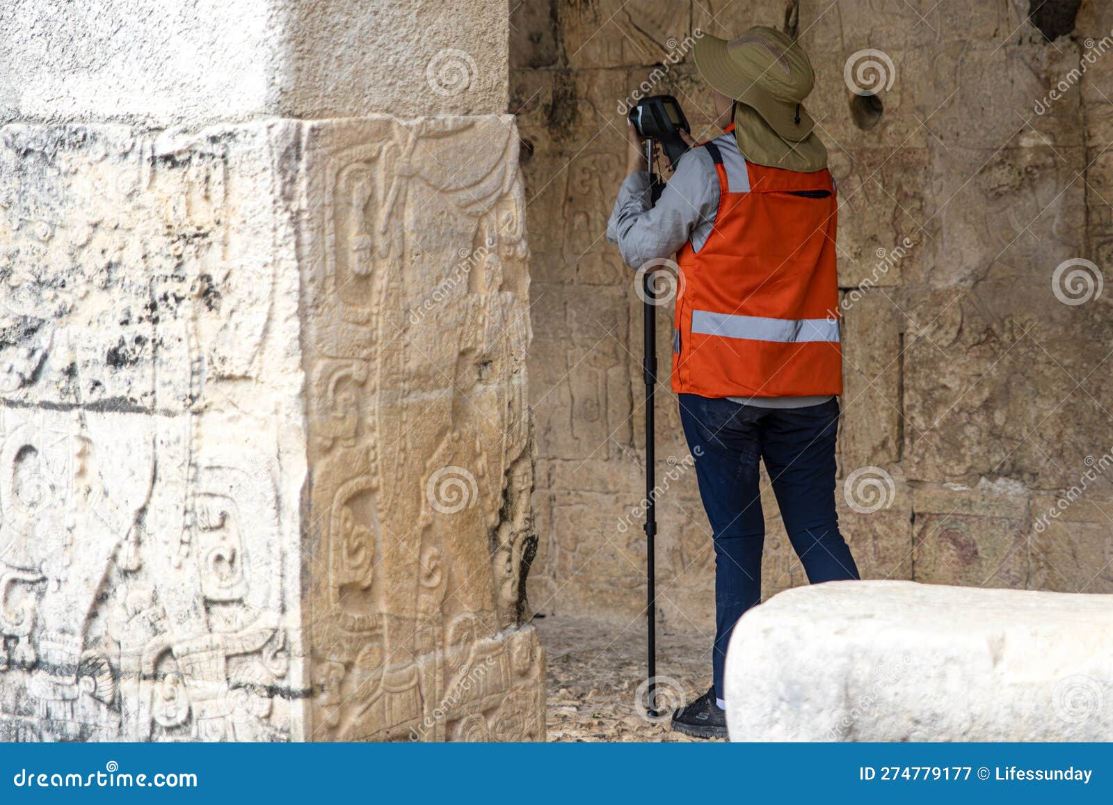An Archaeologist with Instruments Working in One of the Ancient Mayan ...
