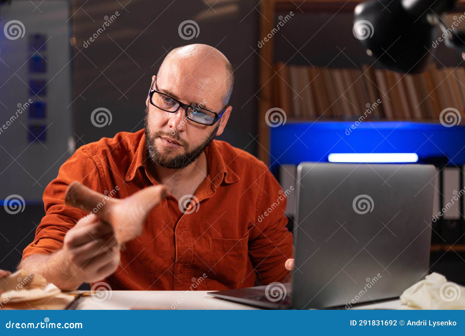 Archaeologist Working Late Night in Office Studying Artifacts Online ...