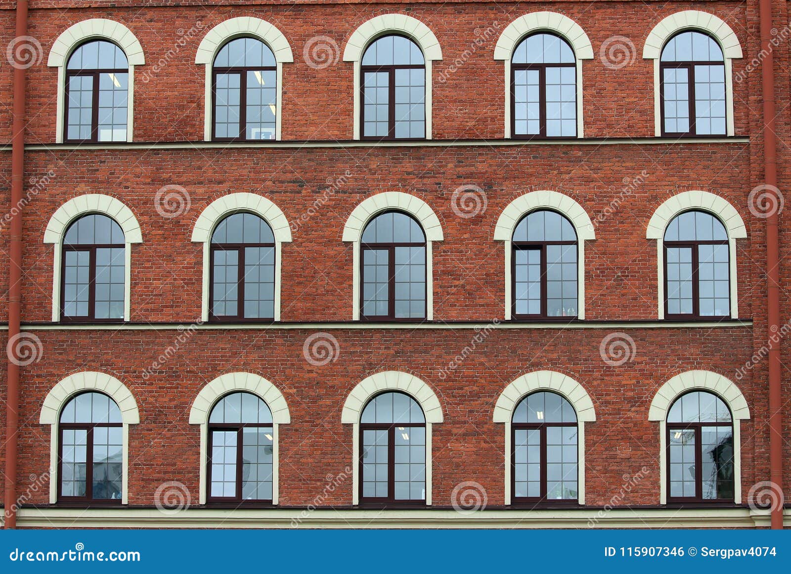 Arched brick house windows stock photo. Image of loft - 115907346