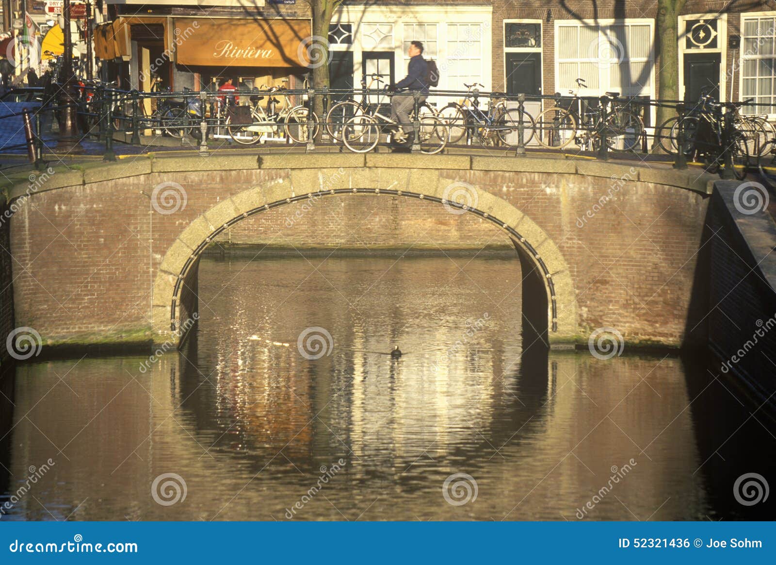 Arched Bridge Over a Canal, Amsterdam, Holland Editorial Photo - Image ...